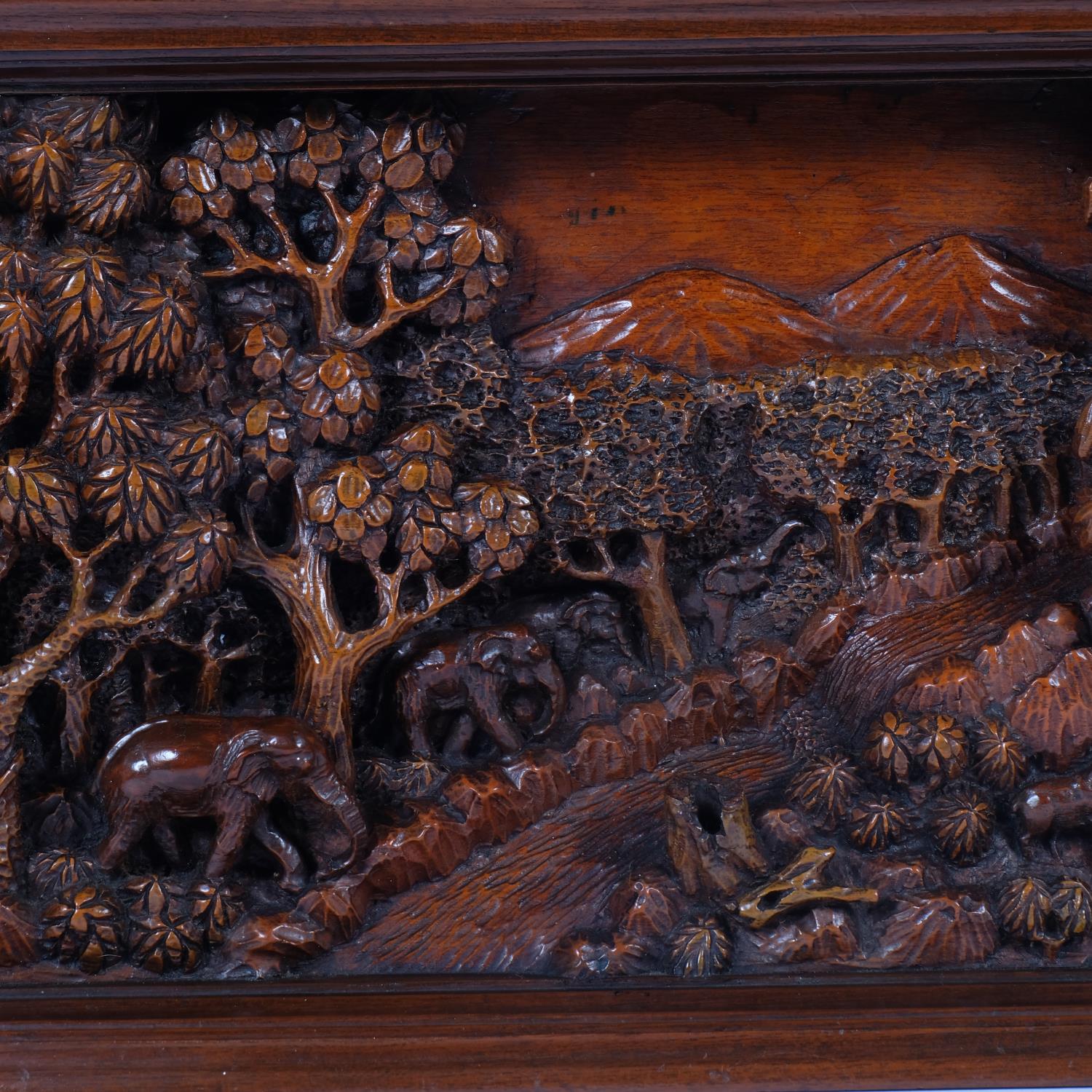 A pair of deeply carved wood wall-hanging diorama panels, depicting ...