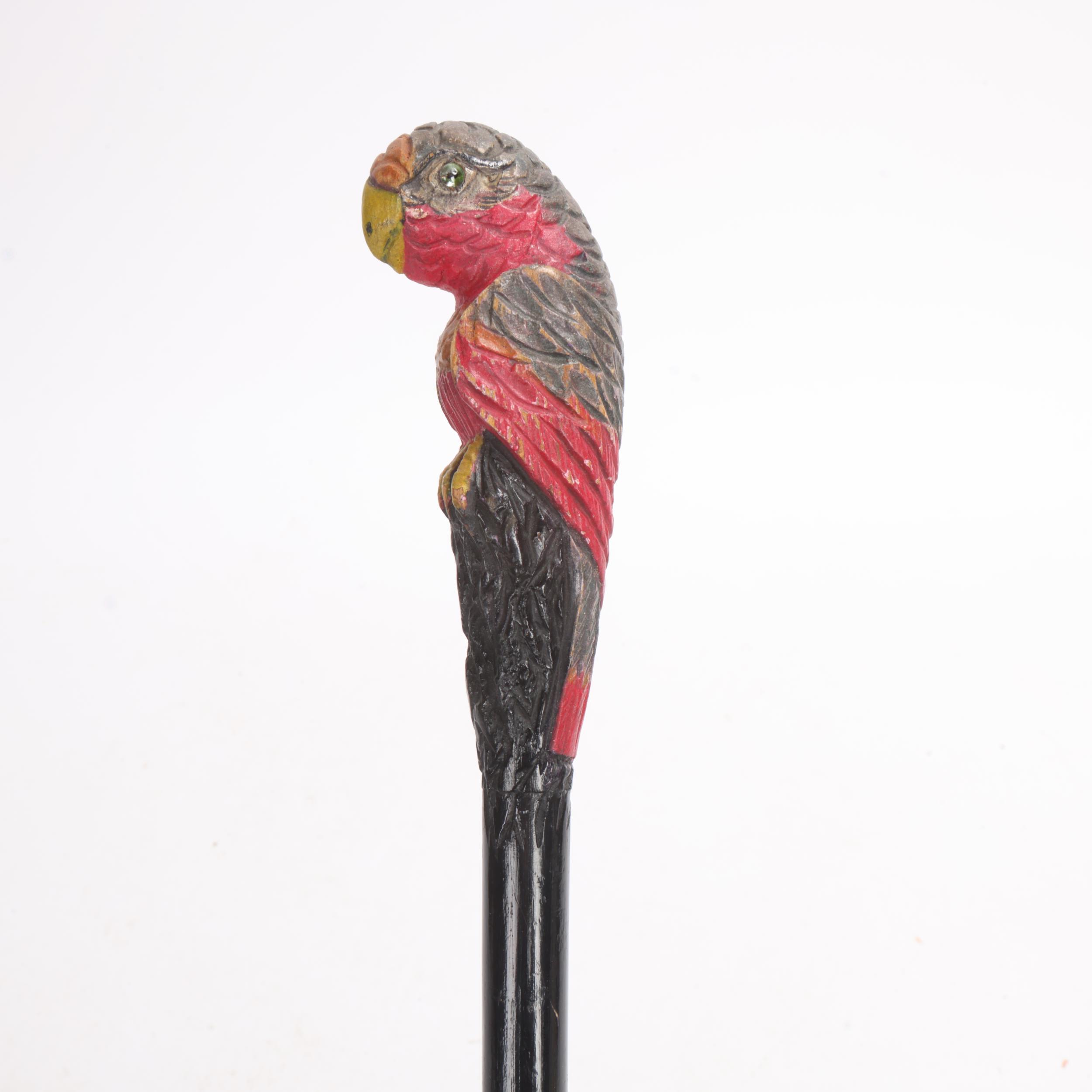 An Edwardian parrot-handled cane, the full standing parrot painted pink ...