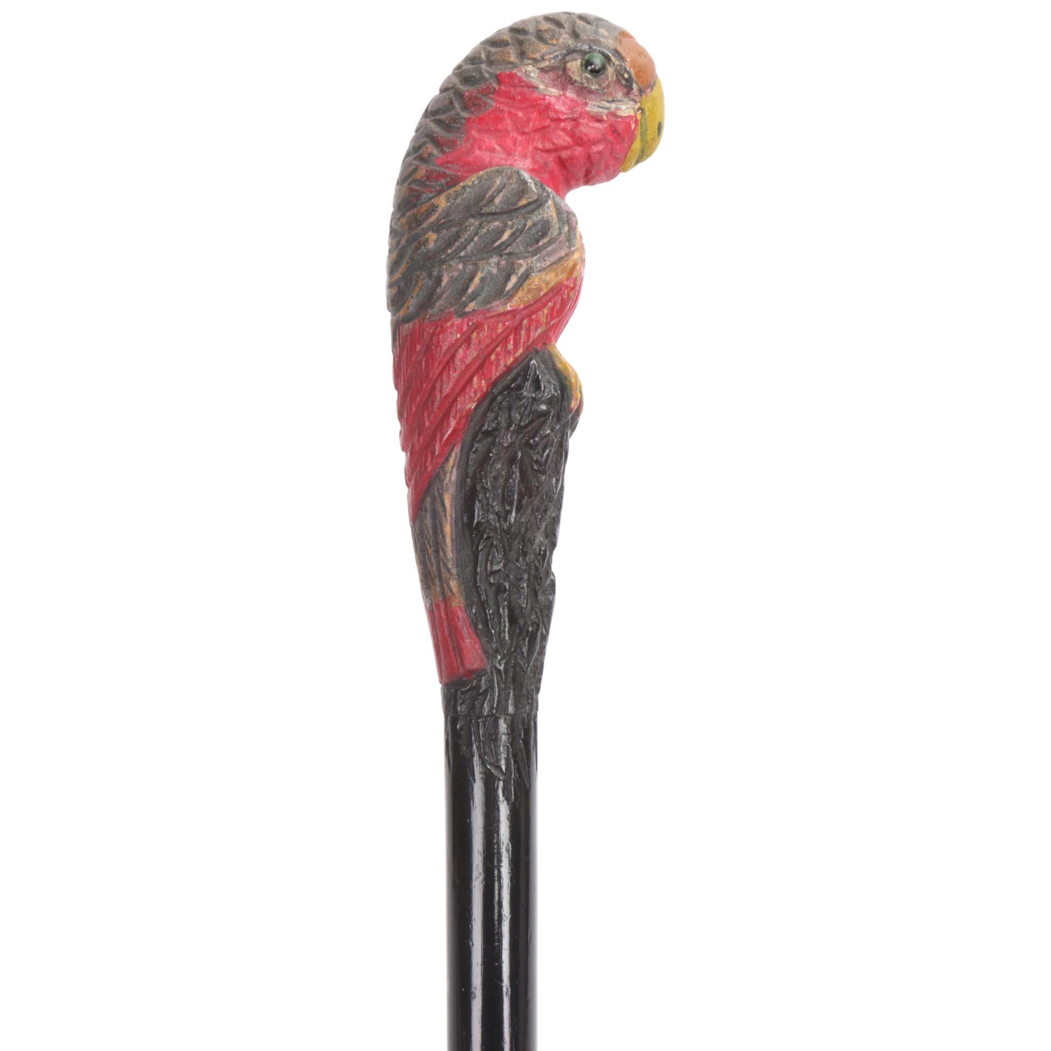 An Edwardian parrot-handled cane, the full standing parrot painted pink ...