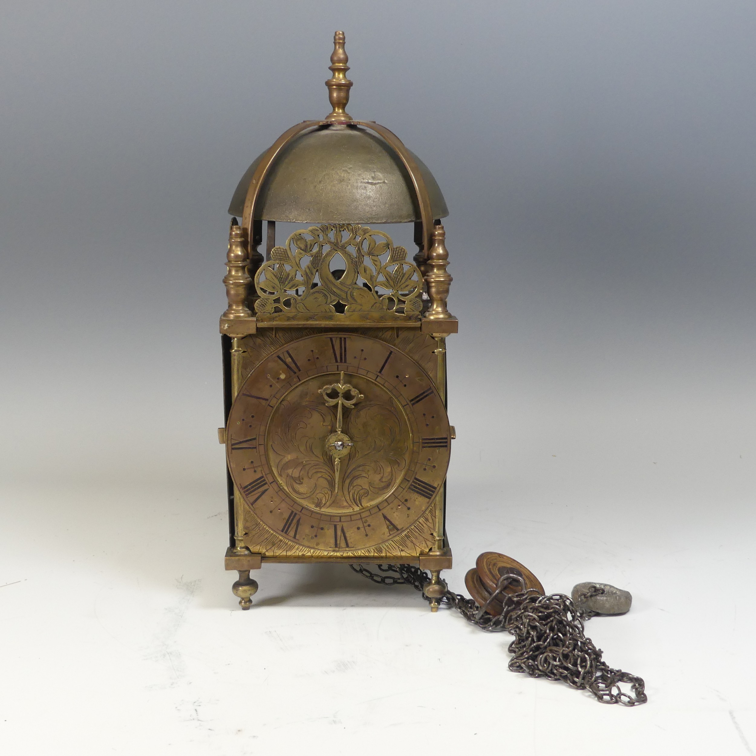 An antique brass Lantern Clock, possibly 17th century and later, bell ...