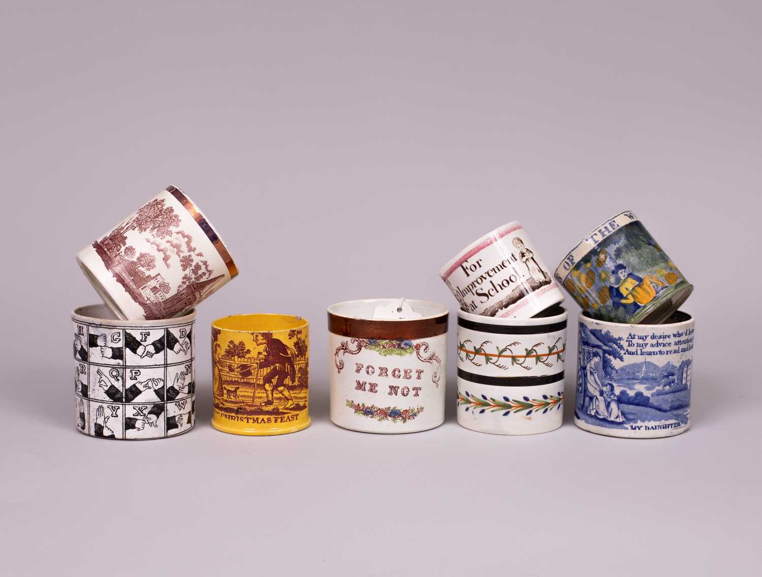Eight 19th Century earthenware children's mugs to include: a yellow ...