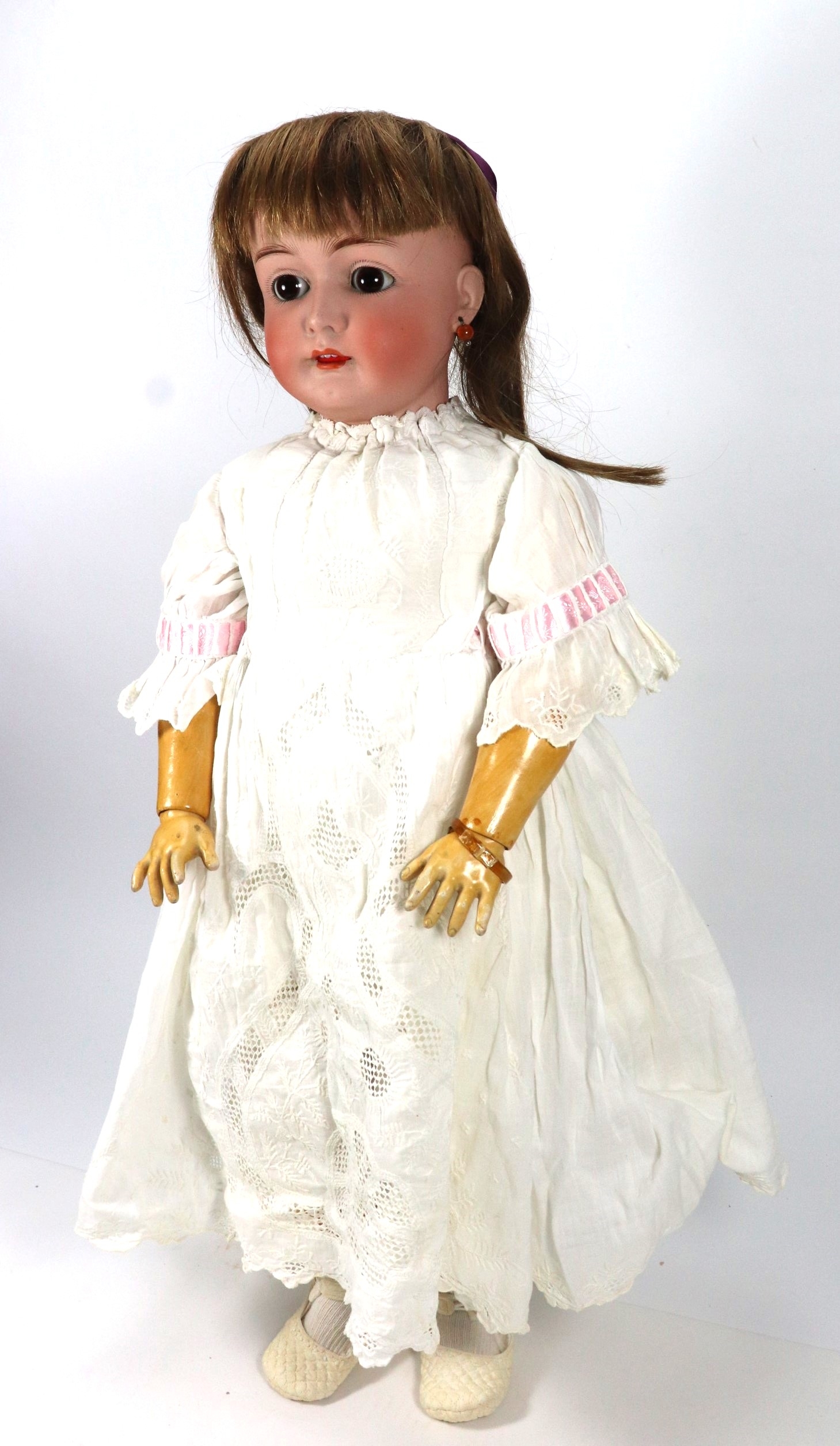 A Simon & Halbig/W.S.K bisque head girl doll, German circa 1910, with ...