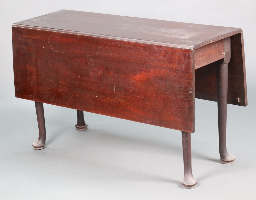A rectangular Georgian mahogany drop flap gateleg dining table, raised ...