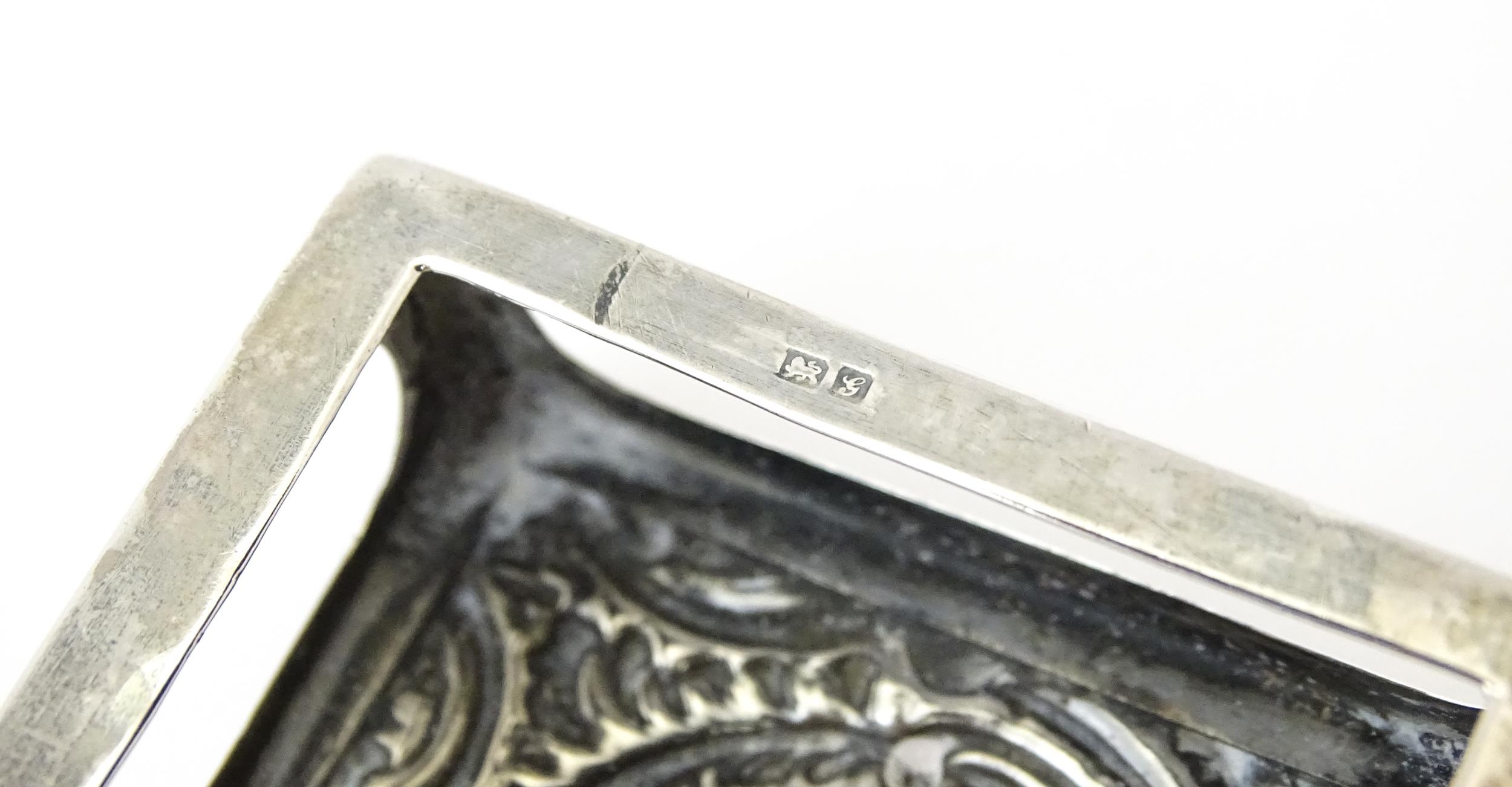 A silver match box cover with embossed decoration, hallmarked Chester ...