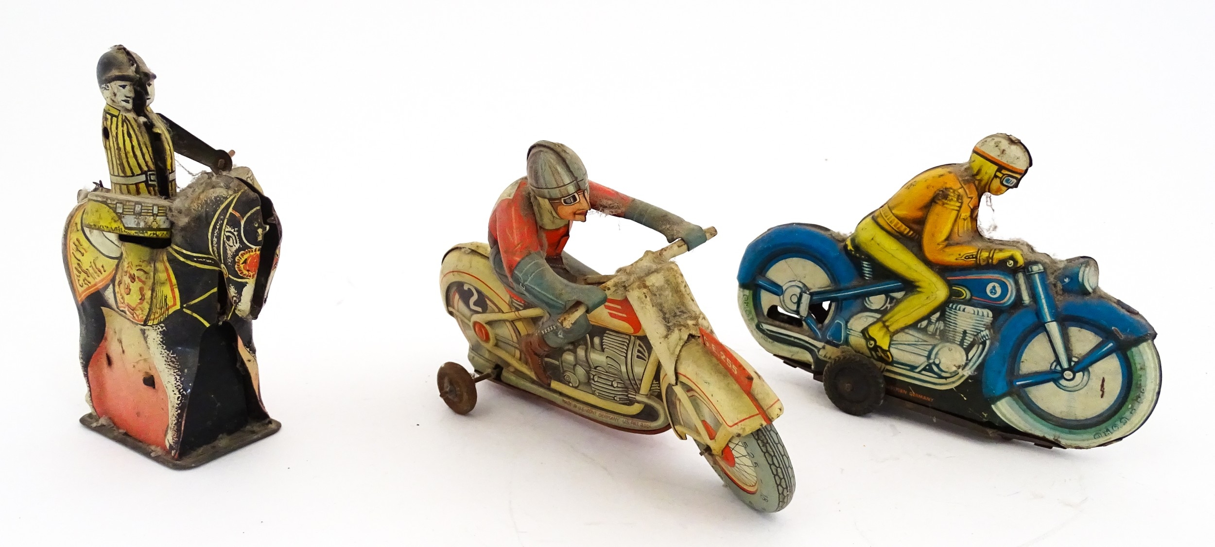 Toys: Three 20thC clockwork / wind up tinplate toys with lithographed ...