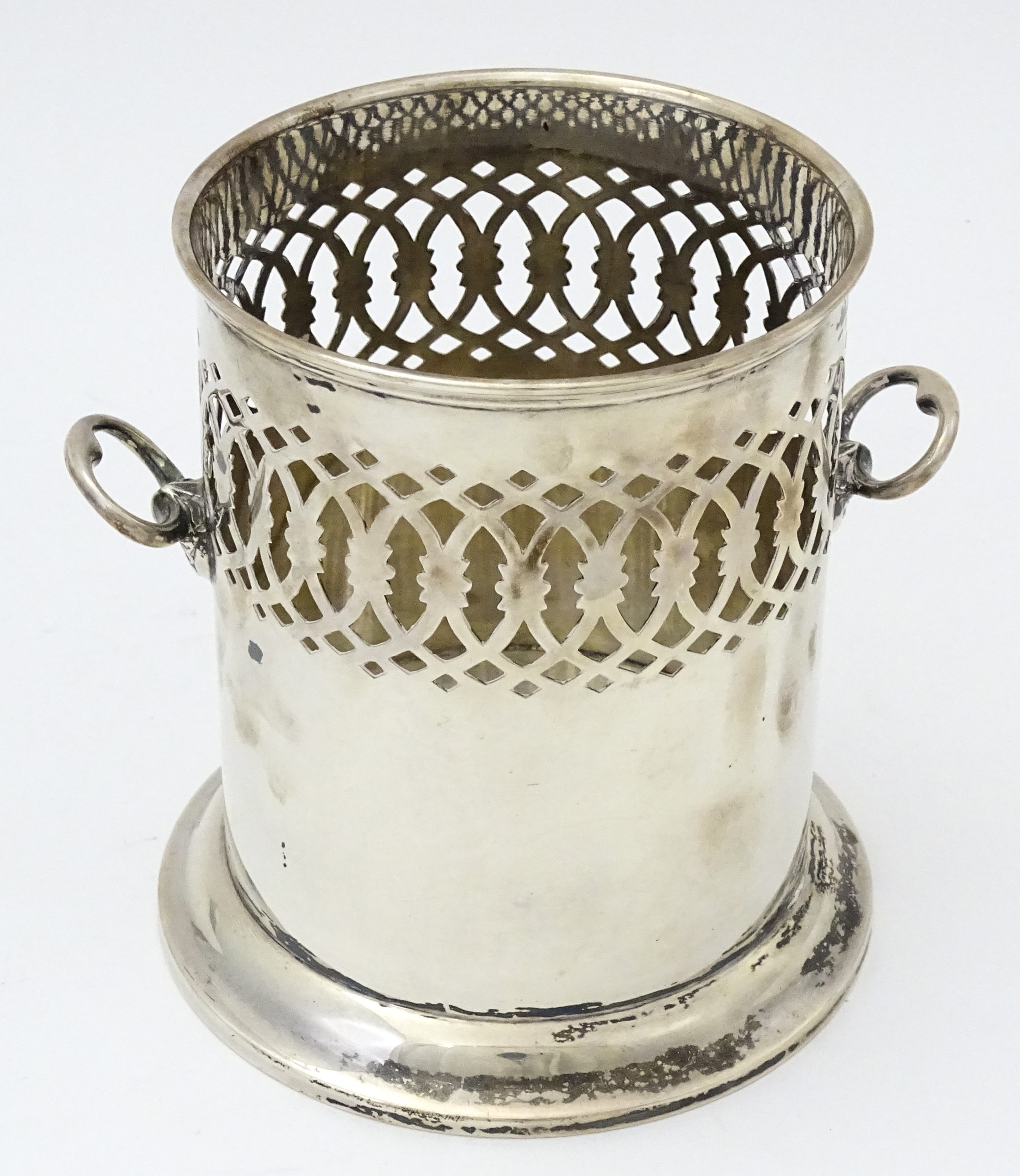 A silver syphon stand / bottle stand with pierced openwork decoration ...