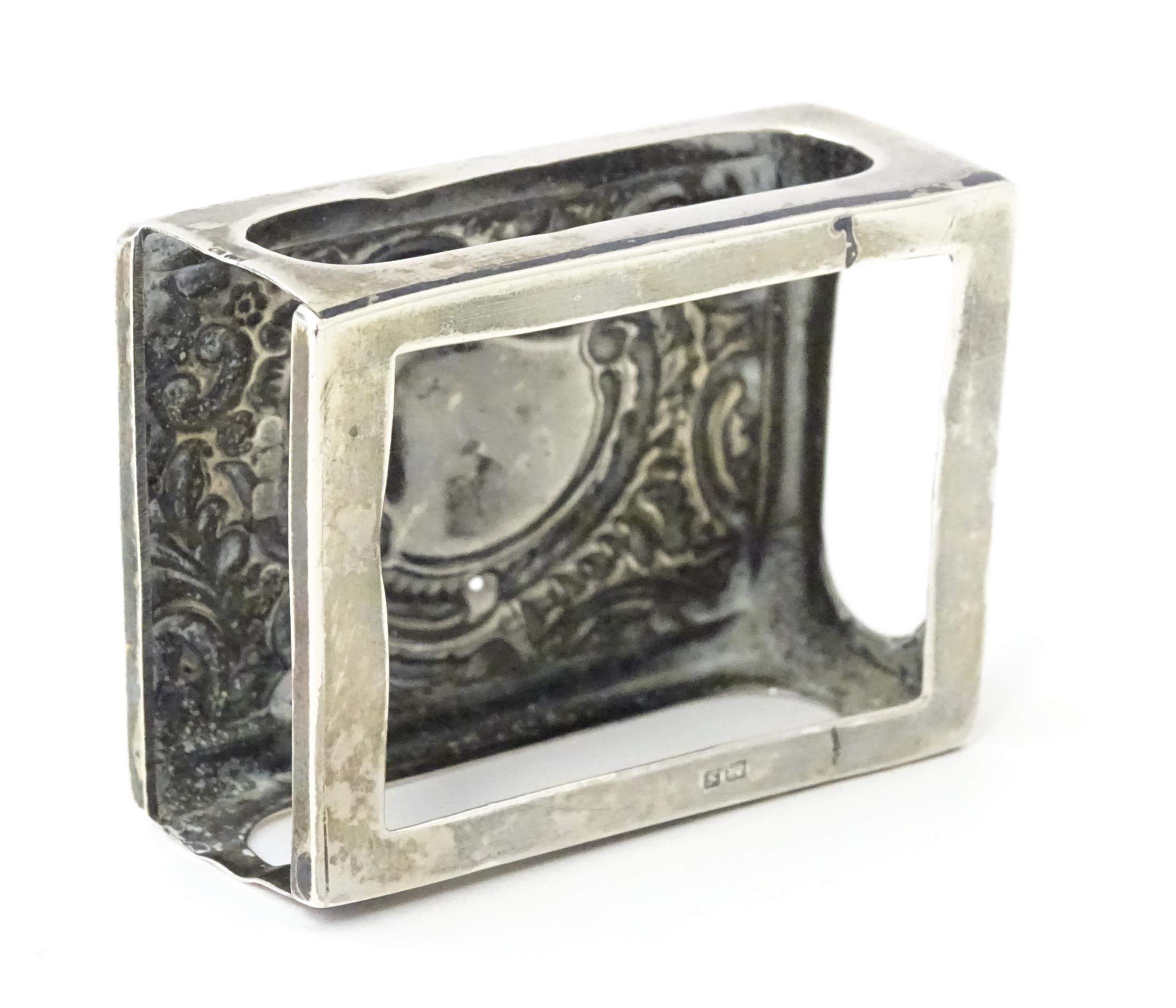 A silver match box cover with embossed decoration, hallmarked Chester ...