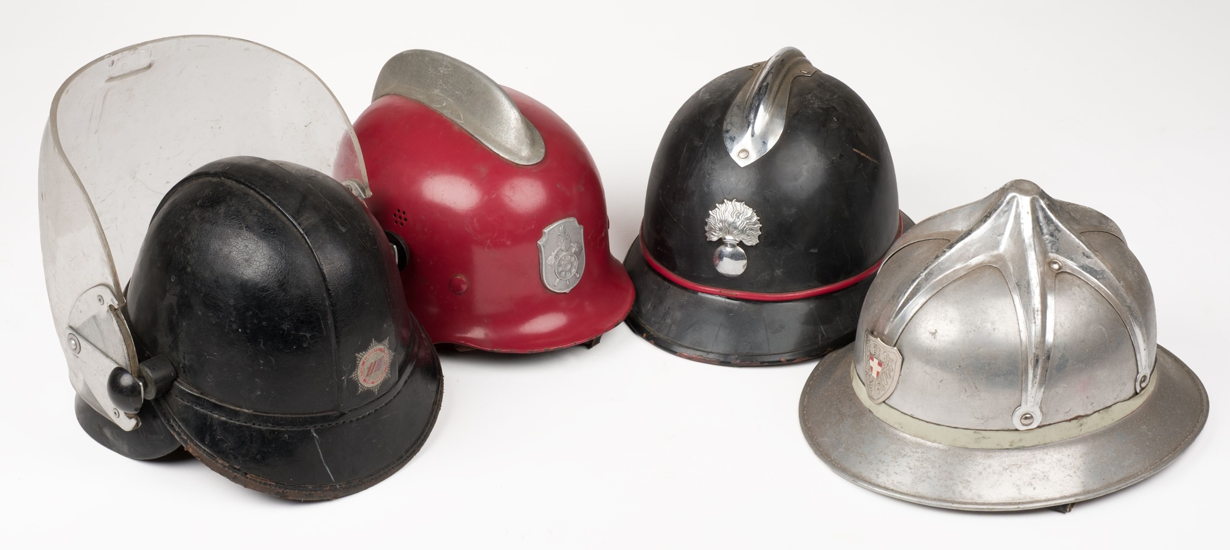 * Fire Fighting. A collection of World firemen's helmets, including ...