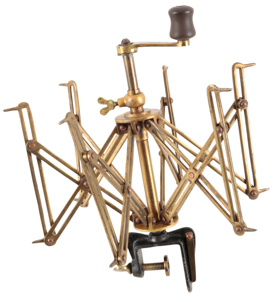 C. FARLOW & CO LTD OF LONDON: A SEXTILE BRASS FOLDING LINE WINDER with ...