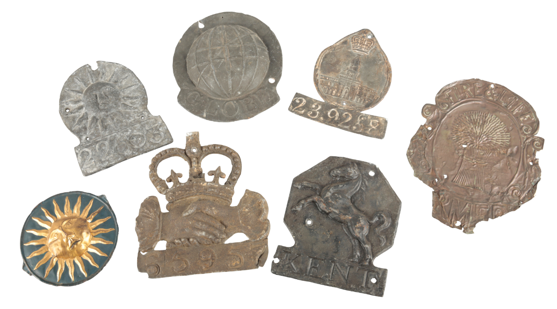 A COLLECTION OF SEVEN FIRE MARKS with lead examples comprising the ...