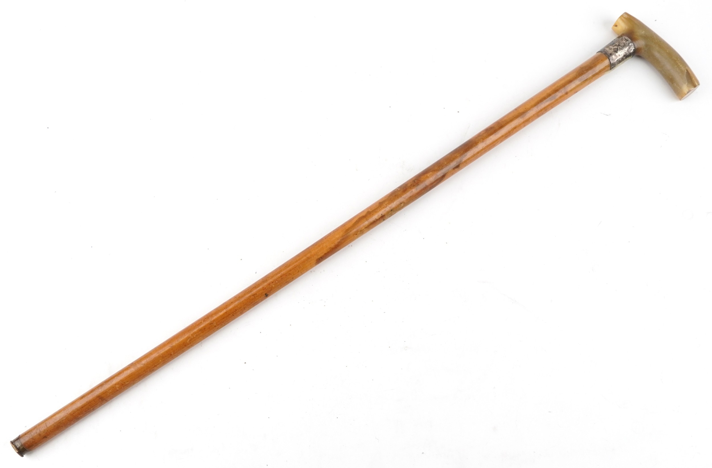 An early 20th century malacca walking cane with horn handle and silver ...