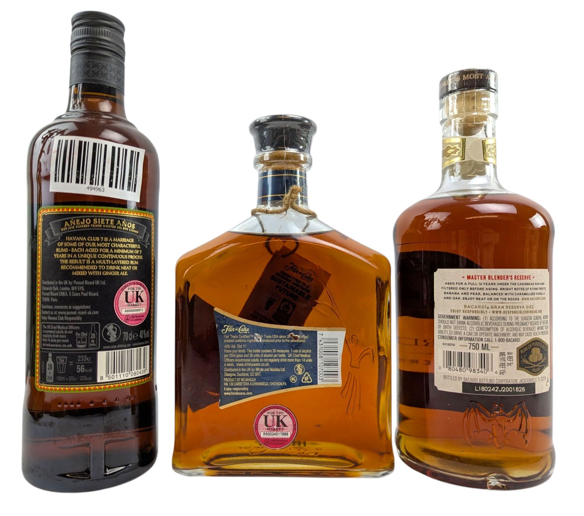 Three aged dark rum bottles. To include a Flor de Cana 12 years old rum ...