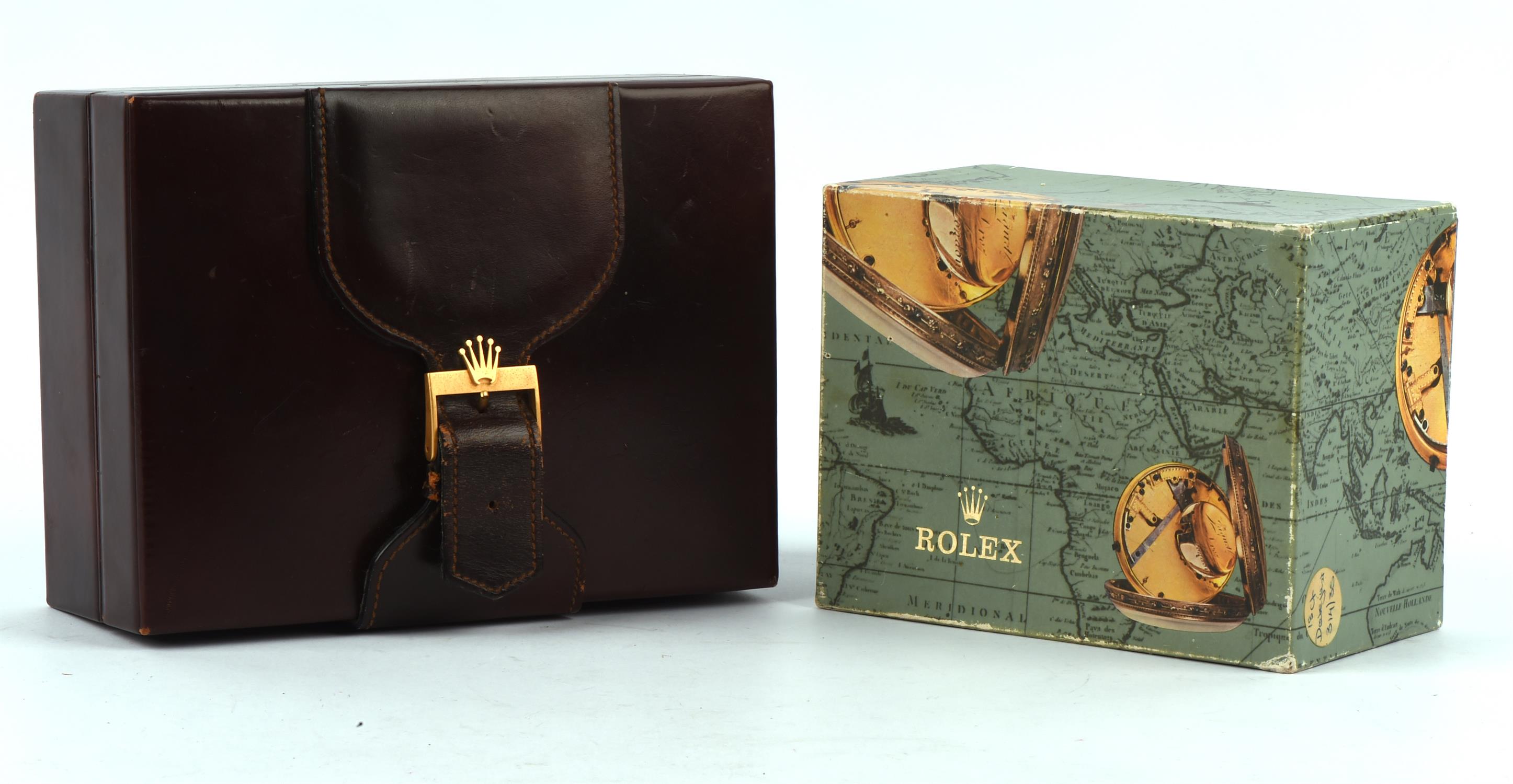 A brown leather Rolex box with wood lined interior and a Rolex Oyster ...