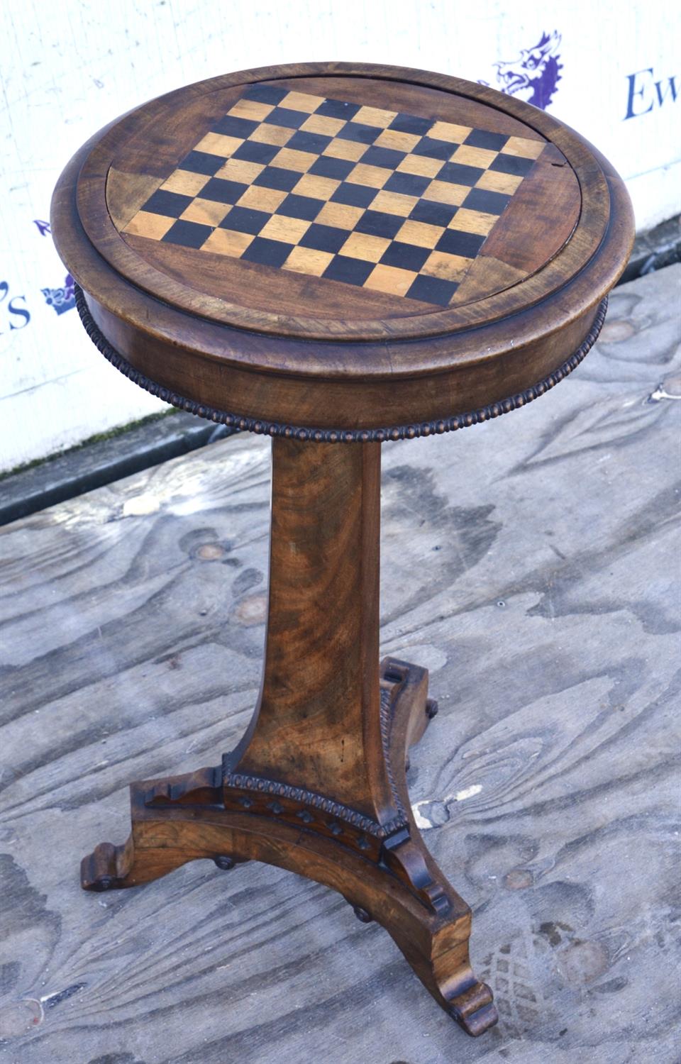 A William IV mahogany pedestal games table, the circular top with inset ...