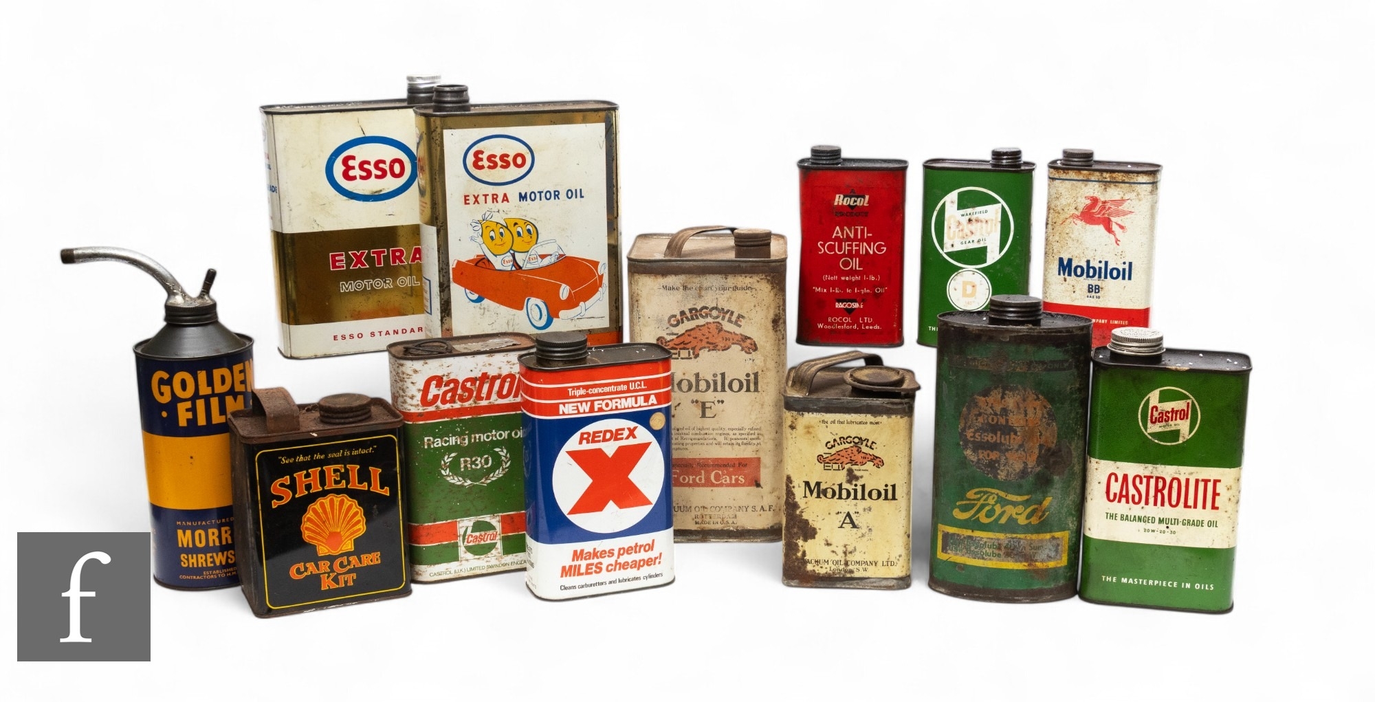 Two Esso extra motor oil pictorial cans, a Gargoyle Mobiloil 'E' can, a ...