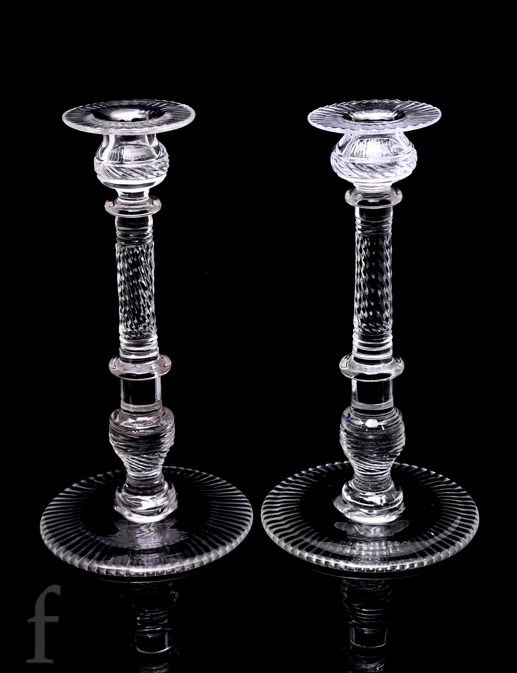 A pair of 19th Century clear crystal glass table candlesticks, the ...