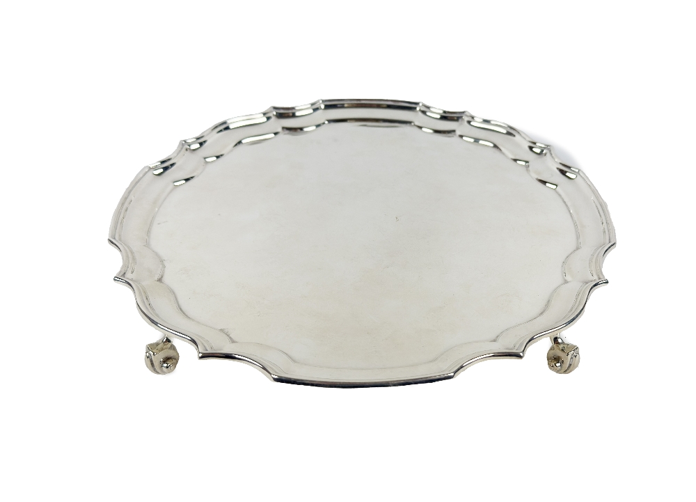 Silver: A Georgian style silver Salver, with shaped edge, on scroll ...