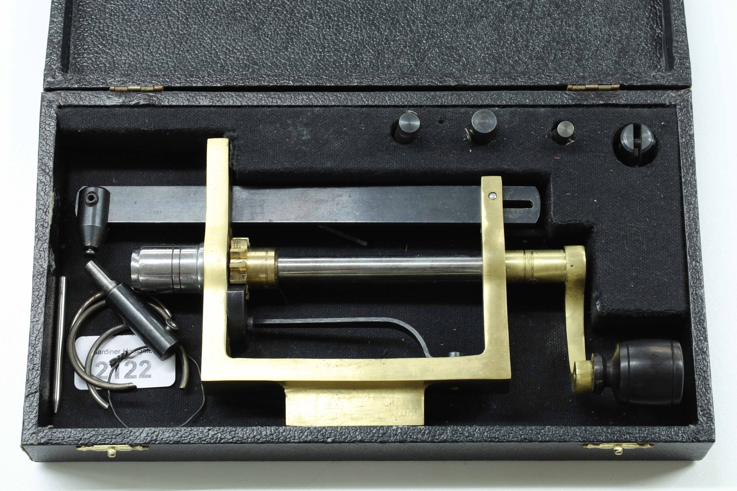 Brass and steel clock mainspring winder, cased with attachments