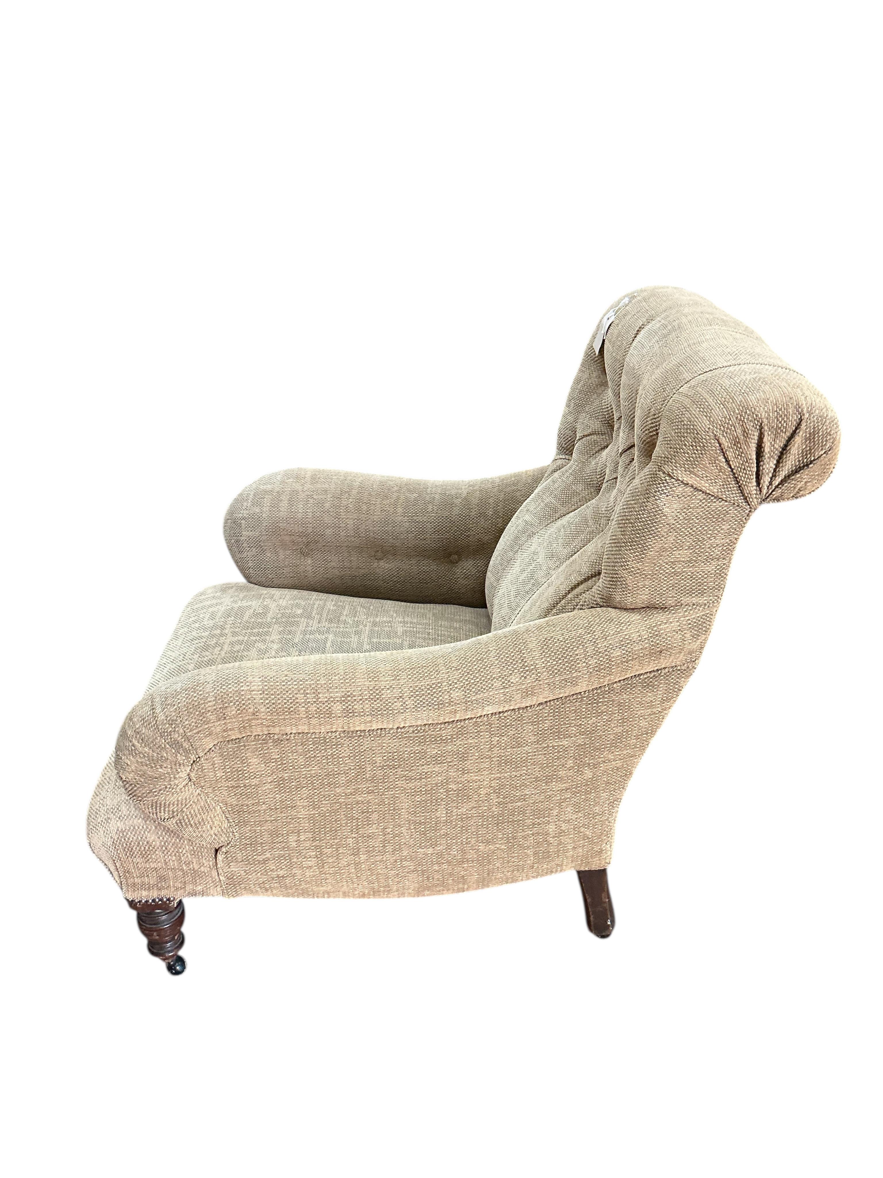 A Victorian Howard style armchair upholstered in buttoned brown tweed ...