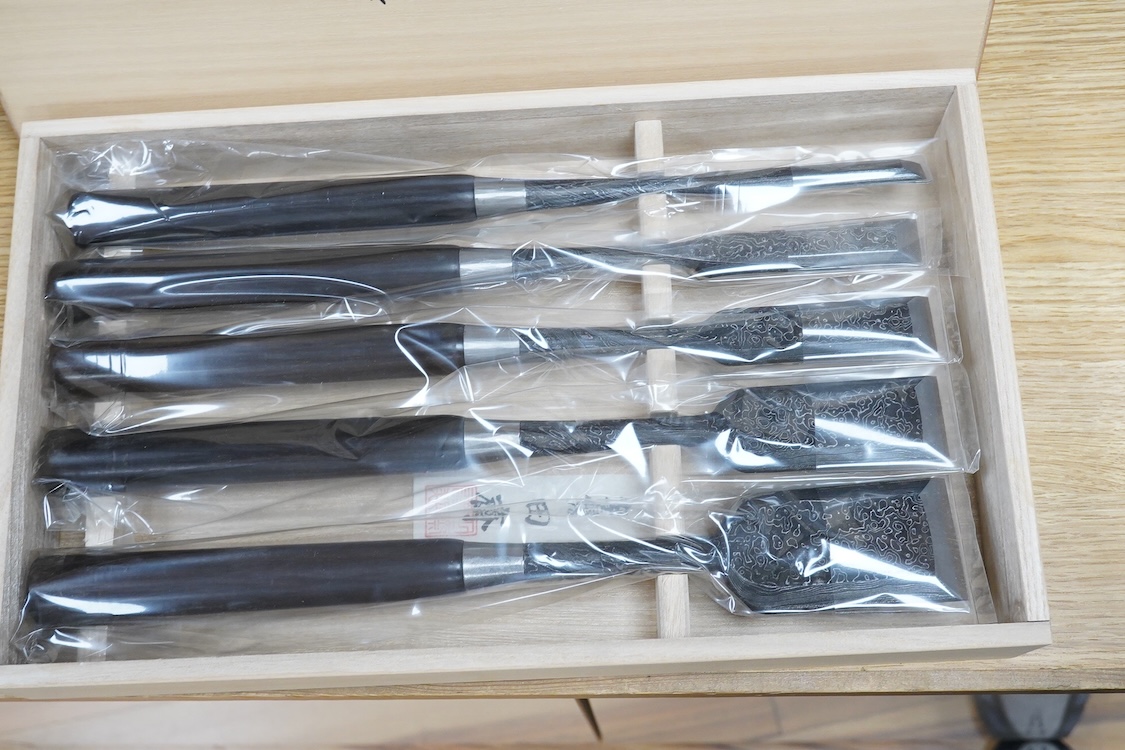 Two wood cased Japanese woodworking chisel sets, a timber framing set ...