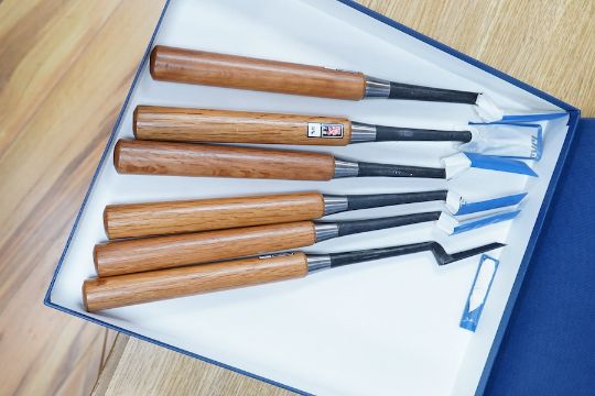 Four sets of Japanese chisels, including a set of six Kote Nomi cranked ...