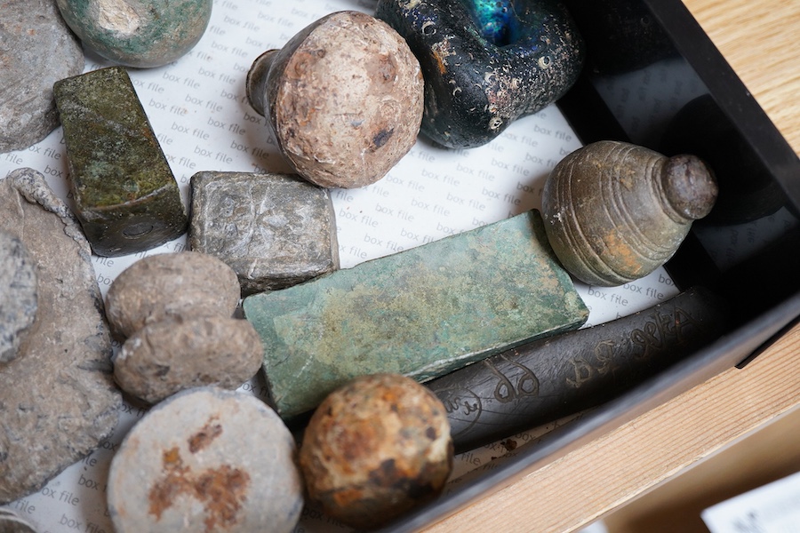 A collection of Roman and other ancient lead weights in various forms ...