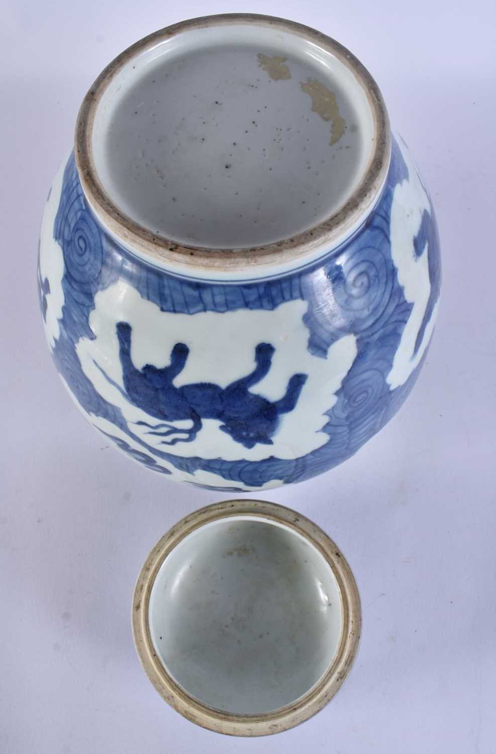 A LARGE CHINESE BLUE AND WHITE JAR AND COVER painted with beasts. 33 cm ...