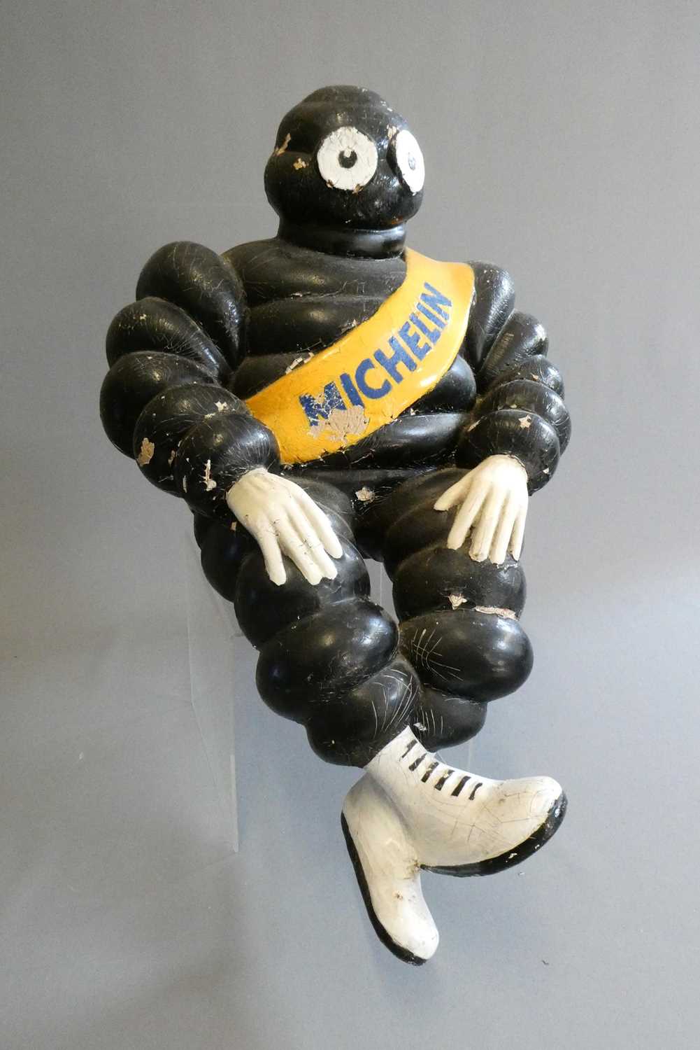 Michelin man, composition construction painted, modelled sitting, 23 ...