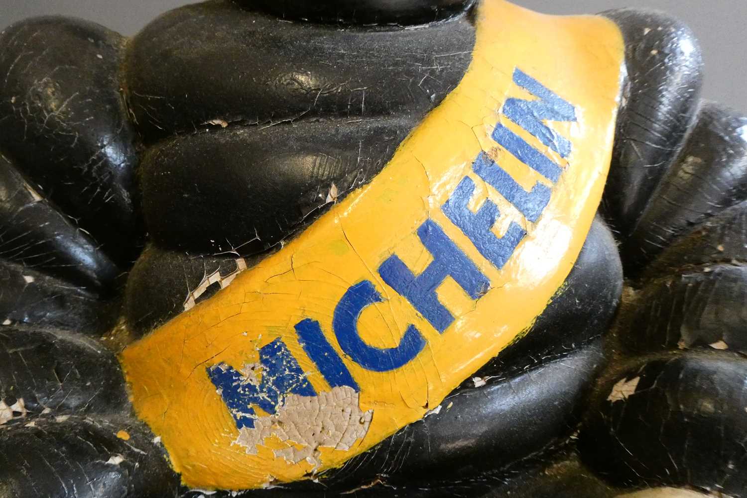 Michelin man, composition construction painted, modelled sitting, 23 ...