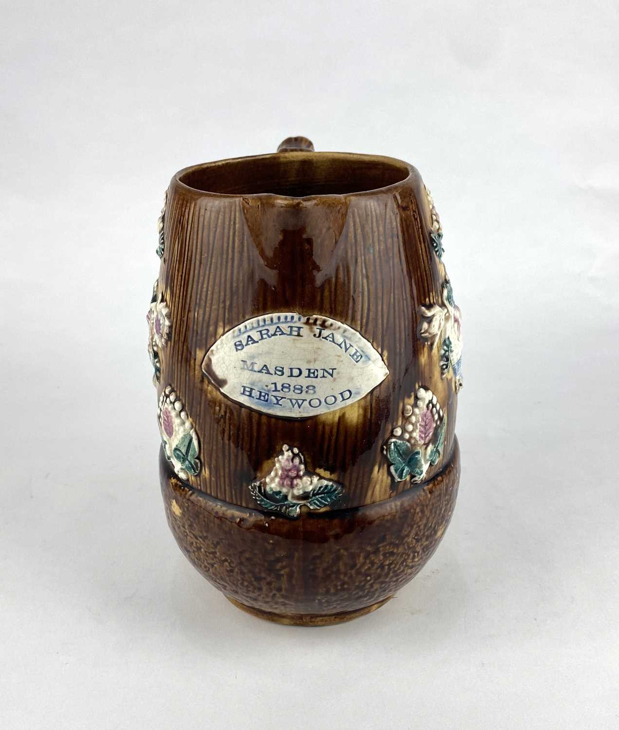 A 19th century Bargeware ceramic jug, inscribed 'Sarah Jane Masden 1883 ...