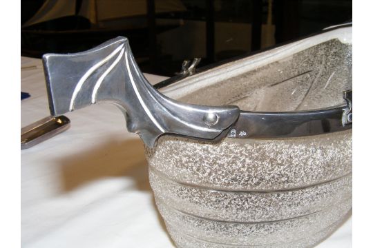 An unusual WMF ice bucket in the form of a Viking longboat with fork ...