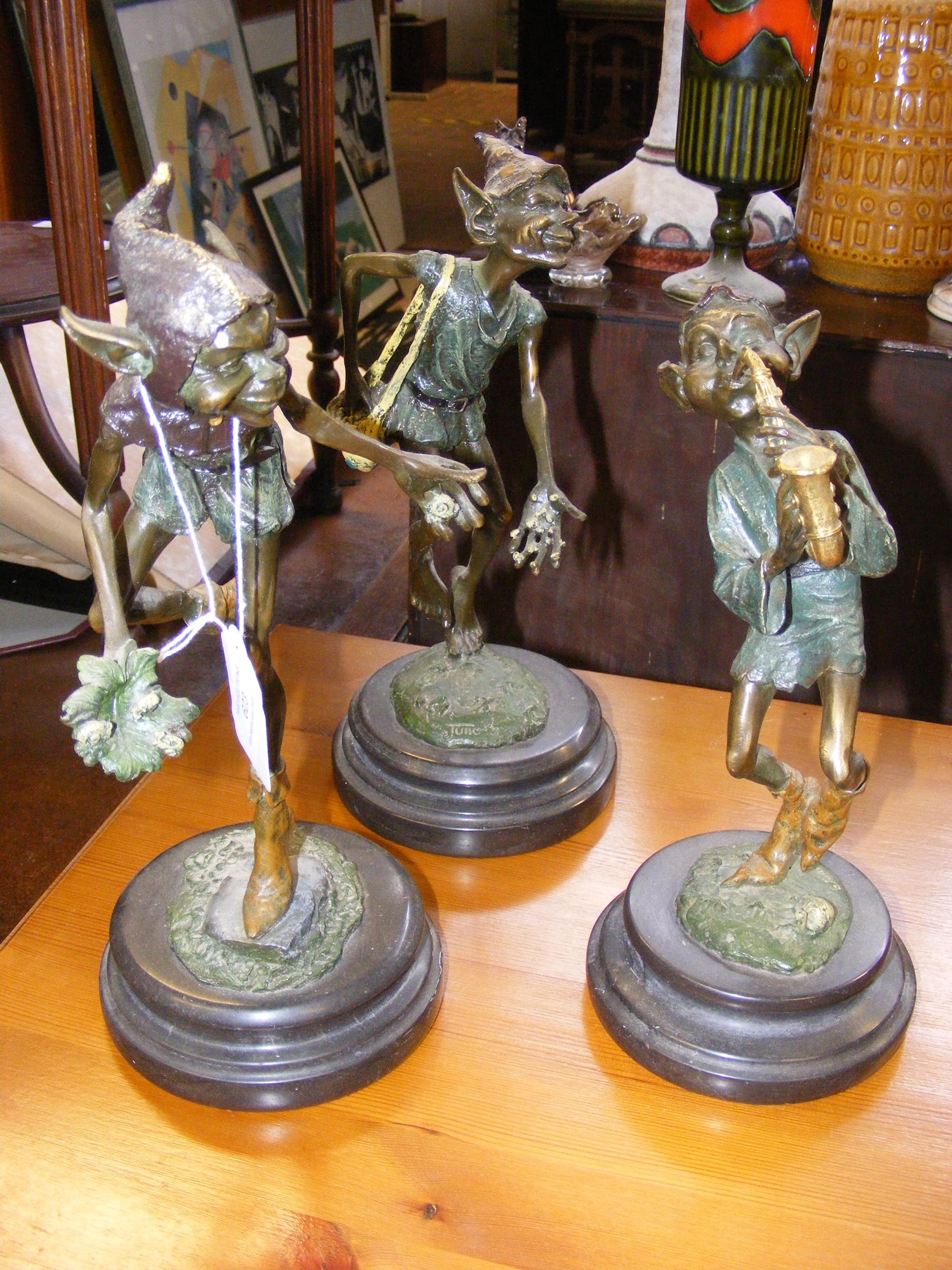 Three bronze figures of elves - inscribed 'Juno'