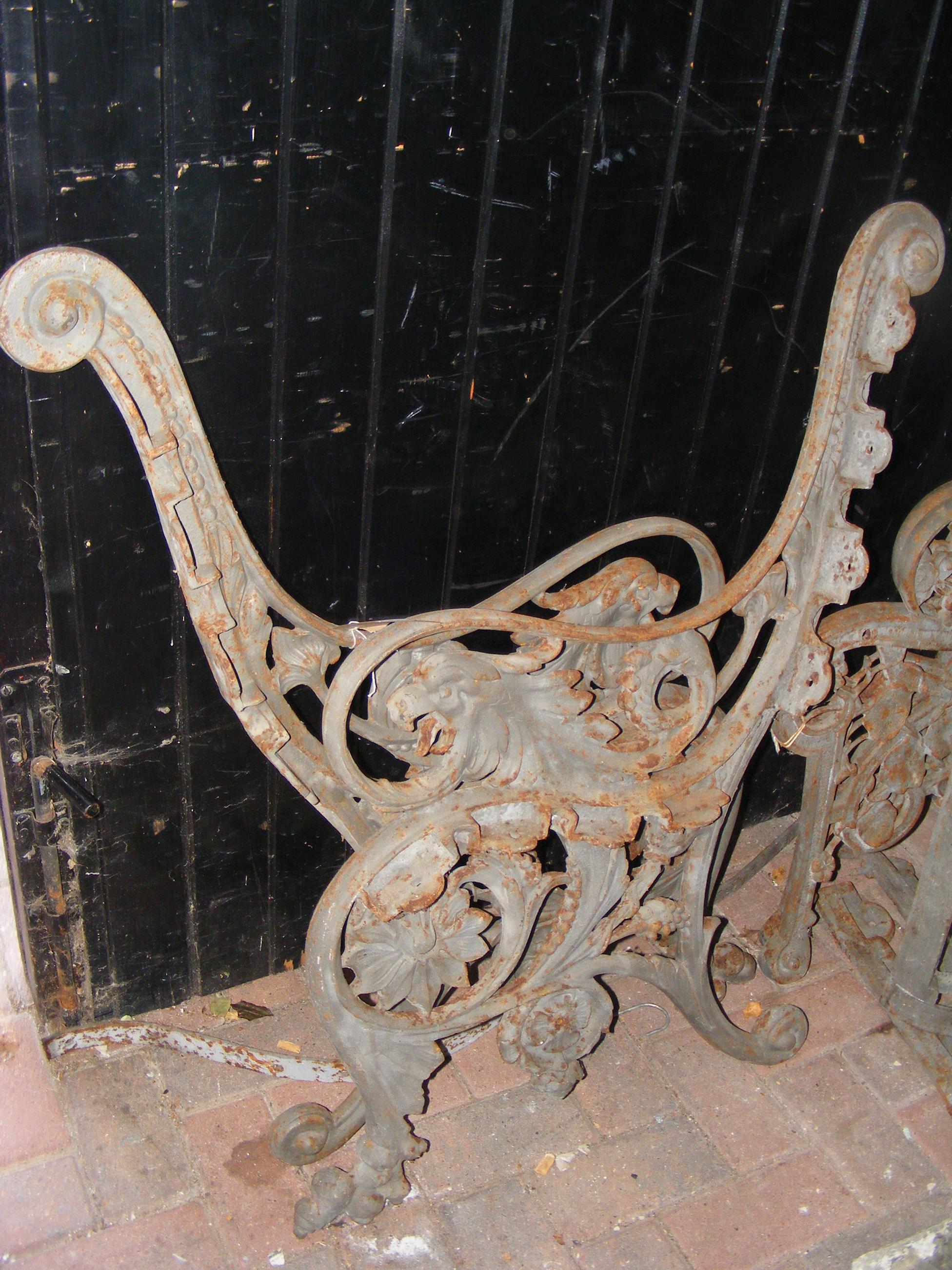 A pair of cast iron bench ends