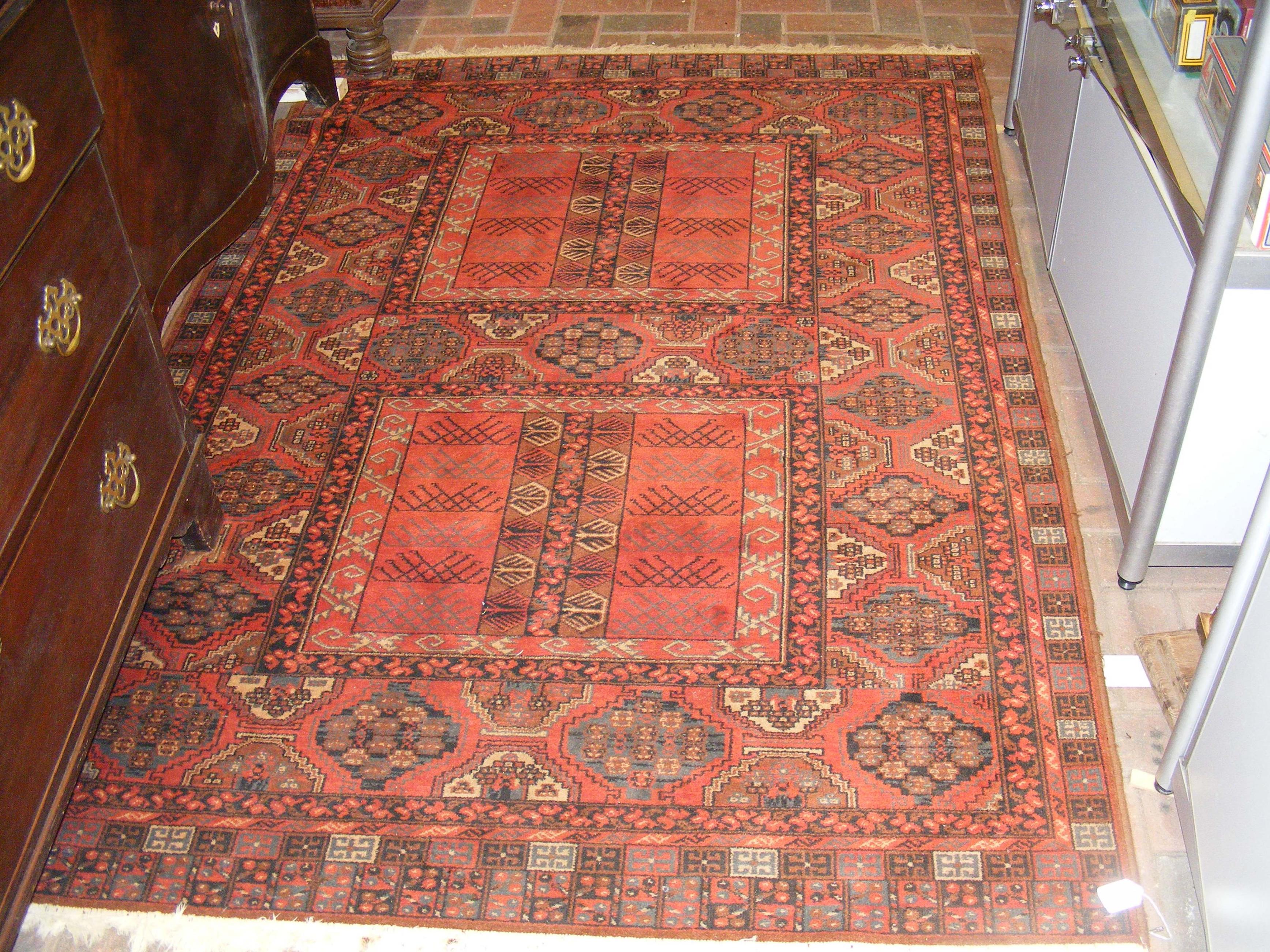 A Middle Eastern style carpet with geometric border - 200cm x 140cm