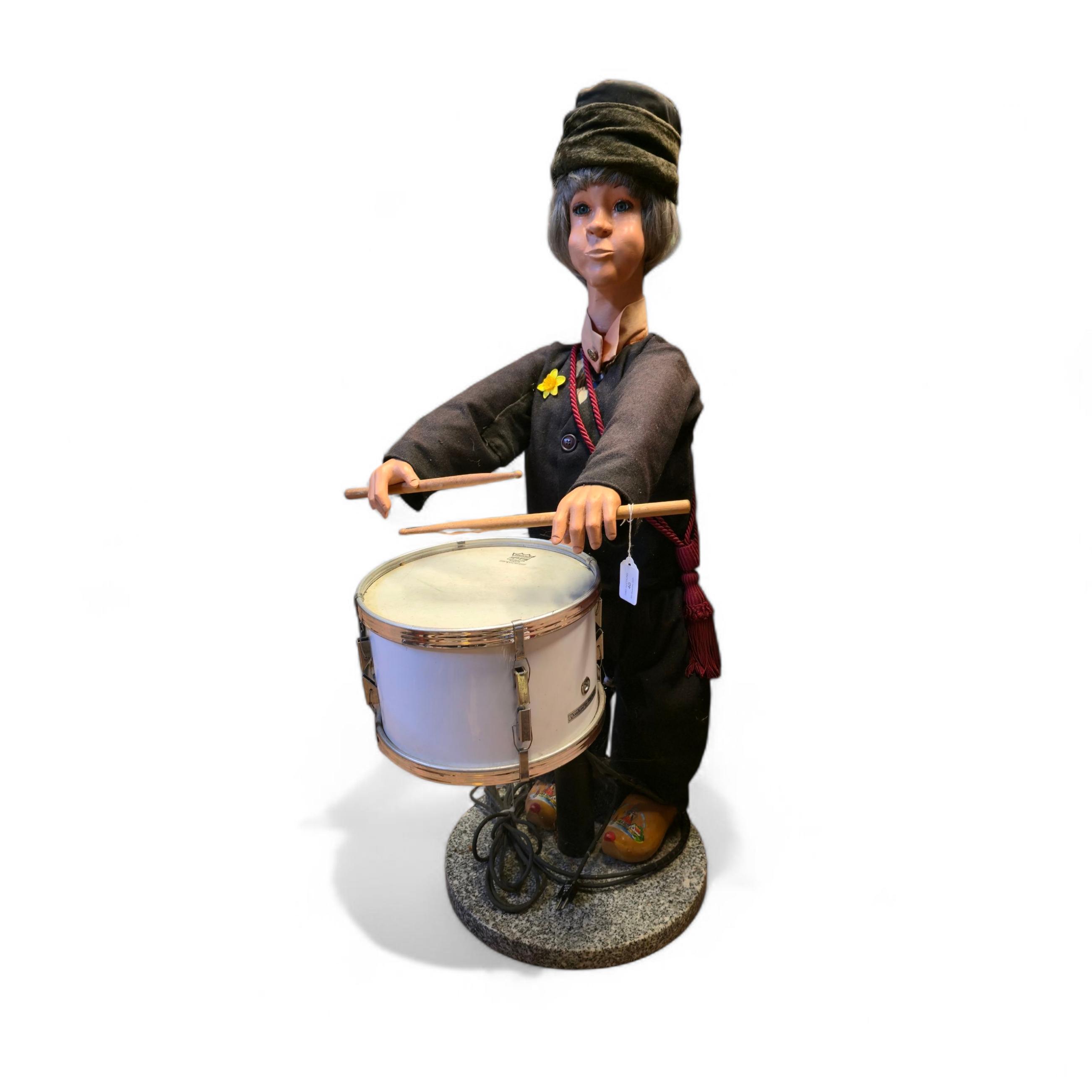 An electric automatum Drummer Boy on circular marble plinth - 110cm high