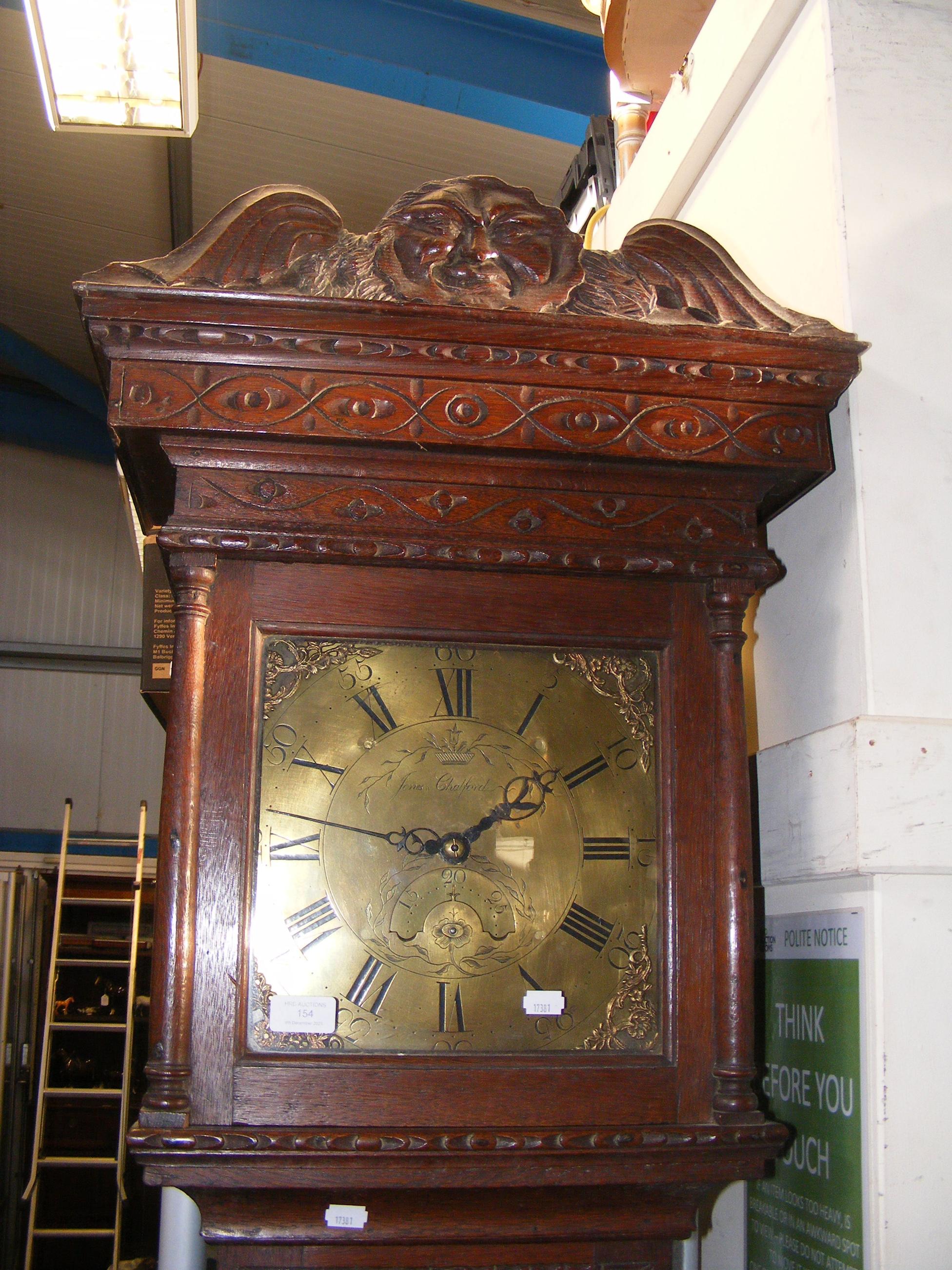 An antique carved oak cased 30 hour longcase clock by Chalford with ...
