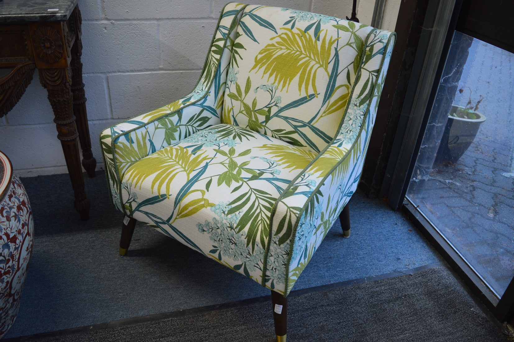 A pair of Next Nina Campbell design armchairs, upholstered with a green ...
