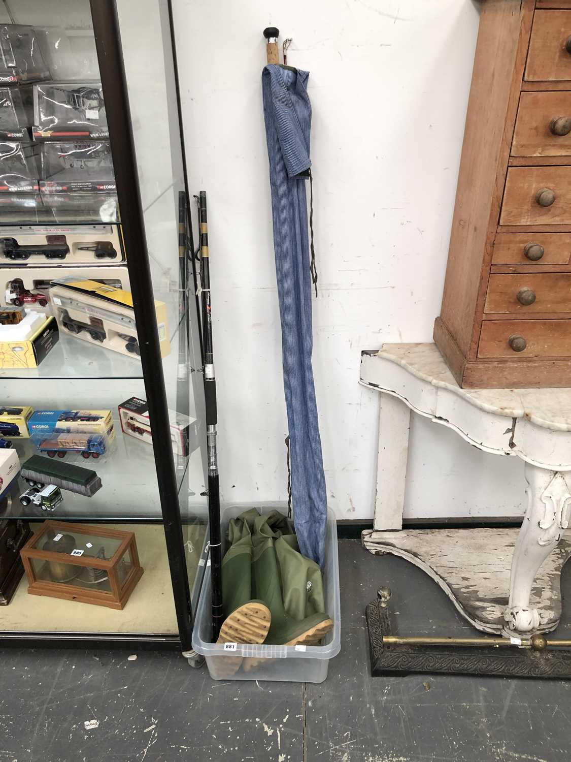 A pair of waders together with Shakespeare and Vortex Valiant fishing rods