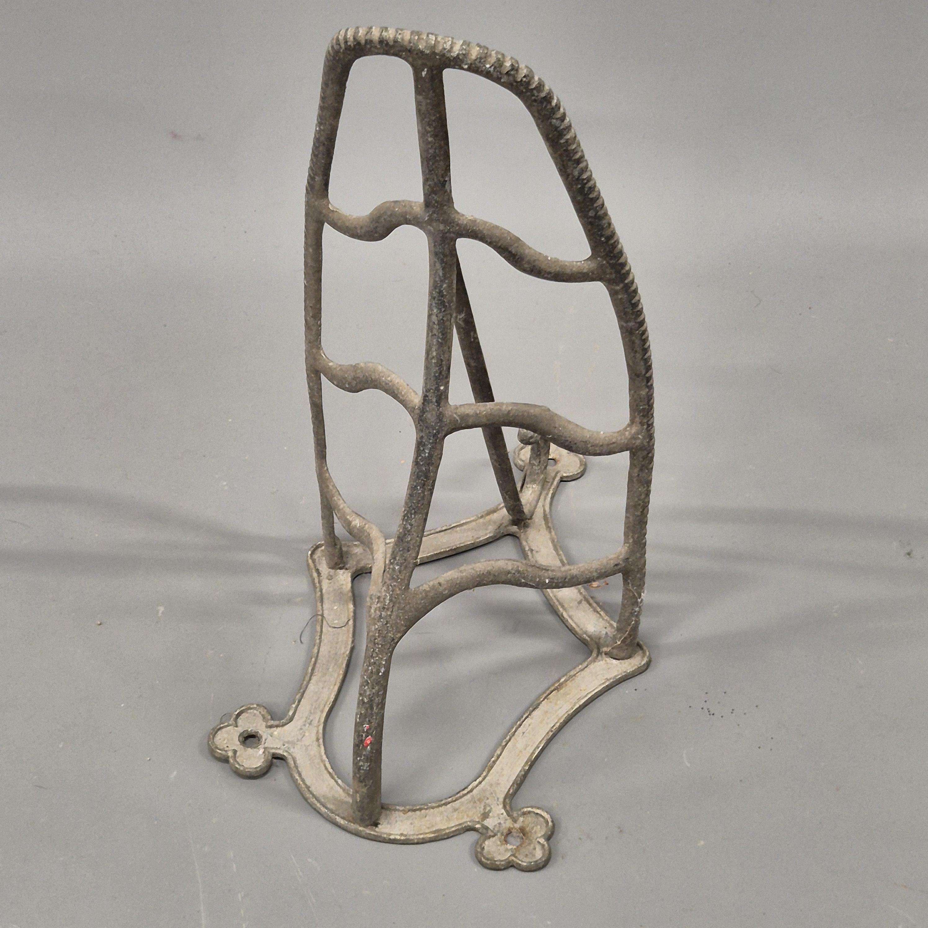 A good quality early 20th- century cast iron saddle rack
