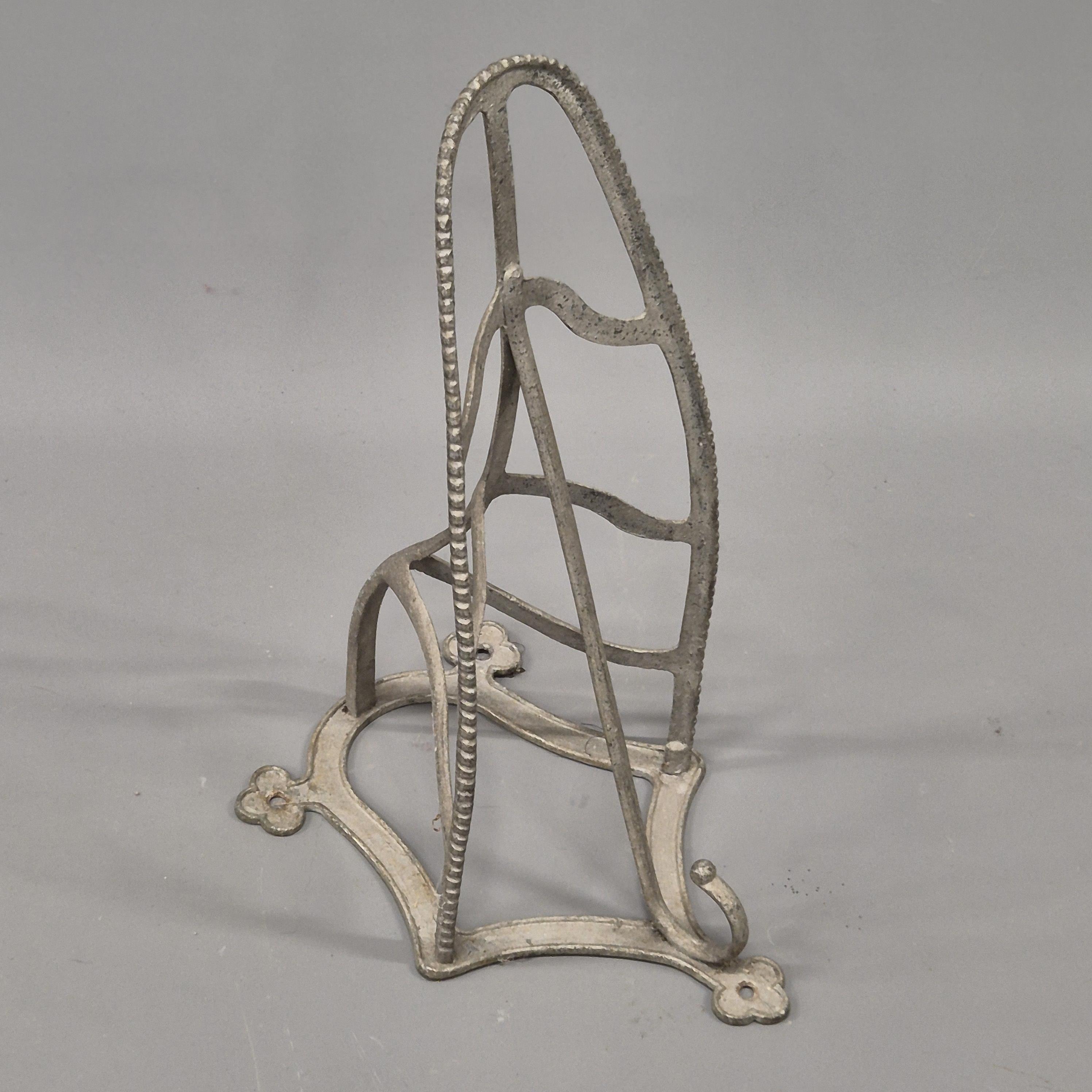 A good quality early 20th- century cast iron saddle rack