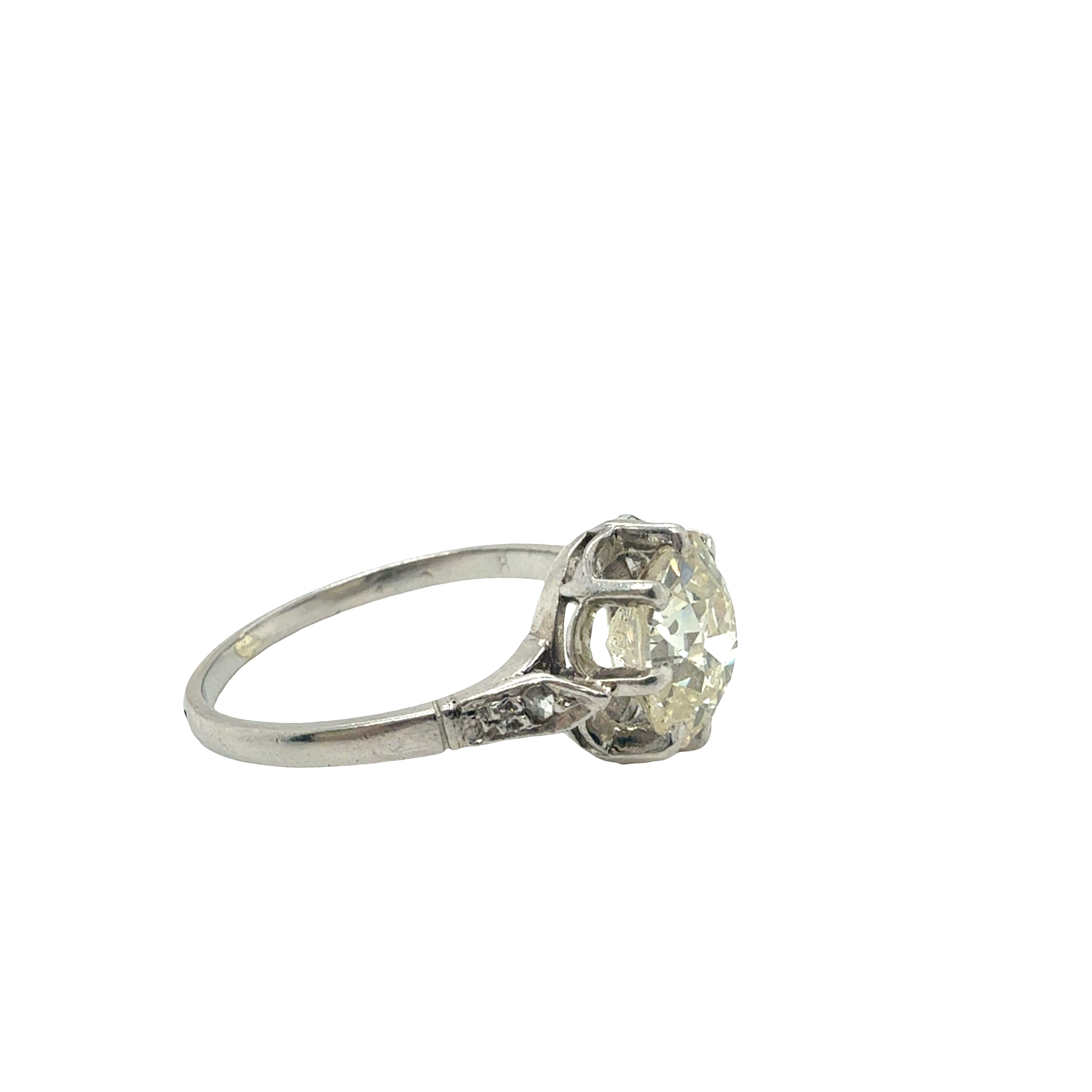 A vintage French platinum & Diamond solitaire ring. The large central ...