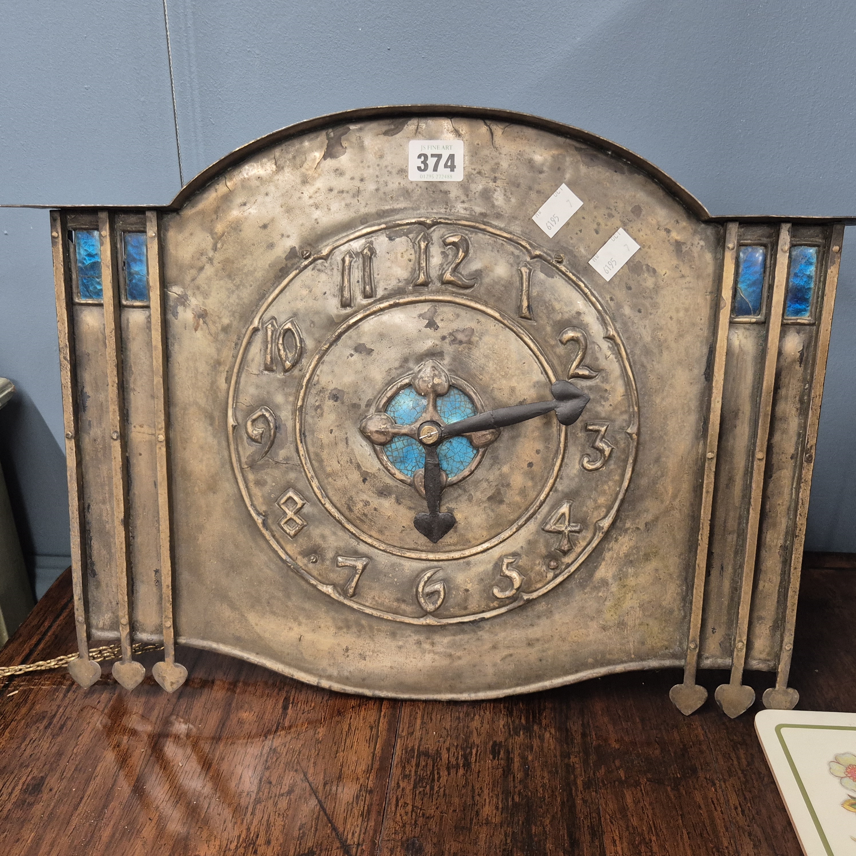 Attributed to a design by George Walton, an Arts and Crafts wall clock ...