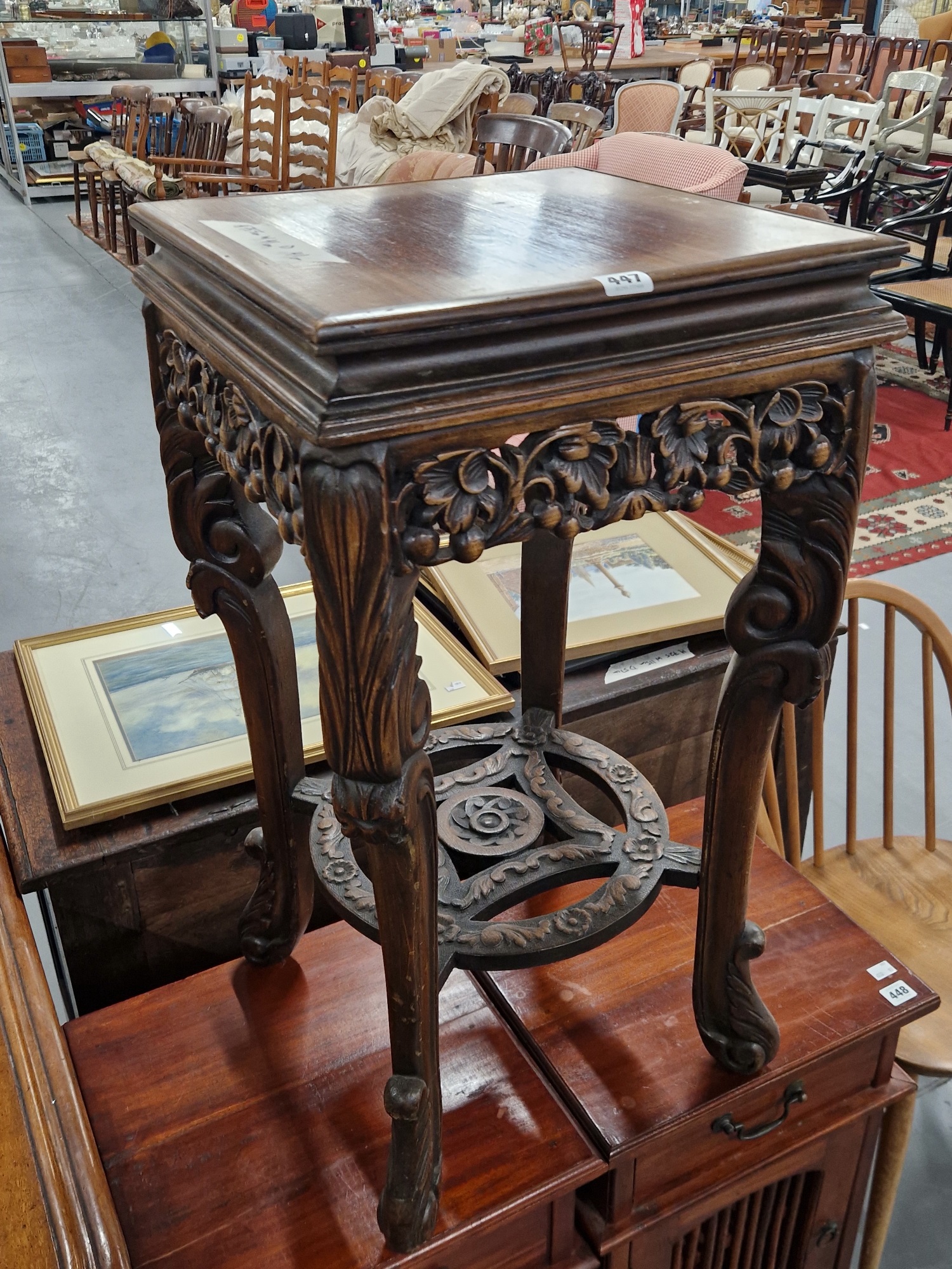 An oriental carved hardwood plant stand