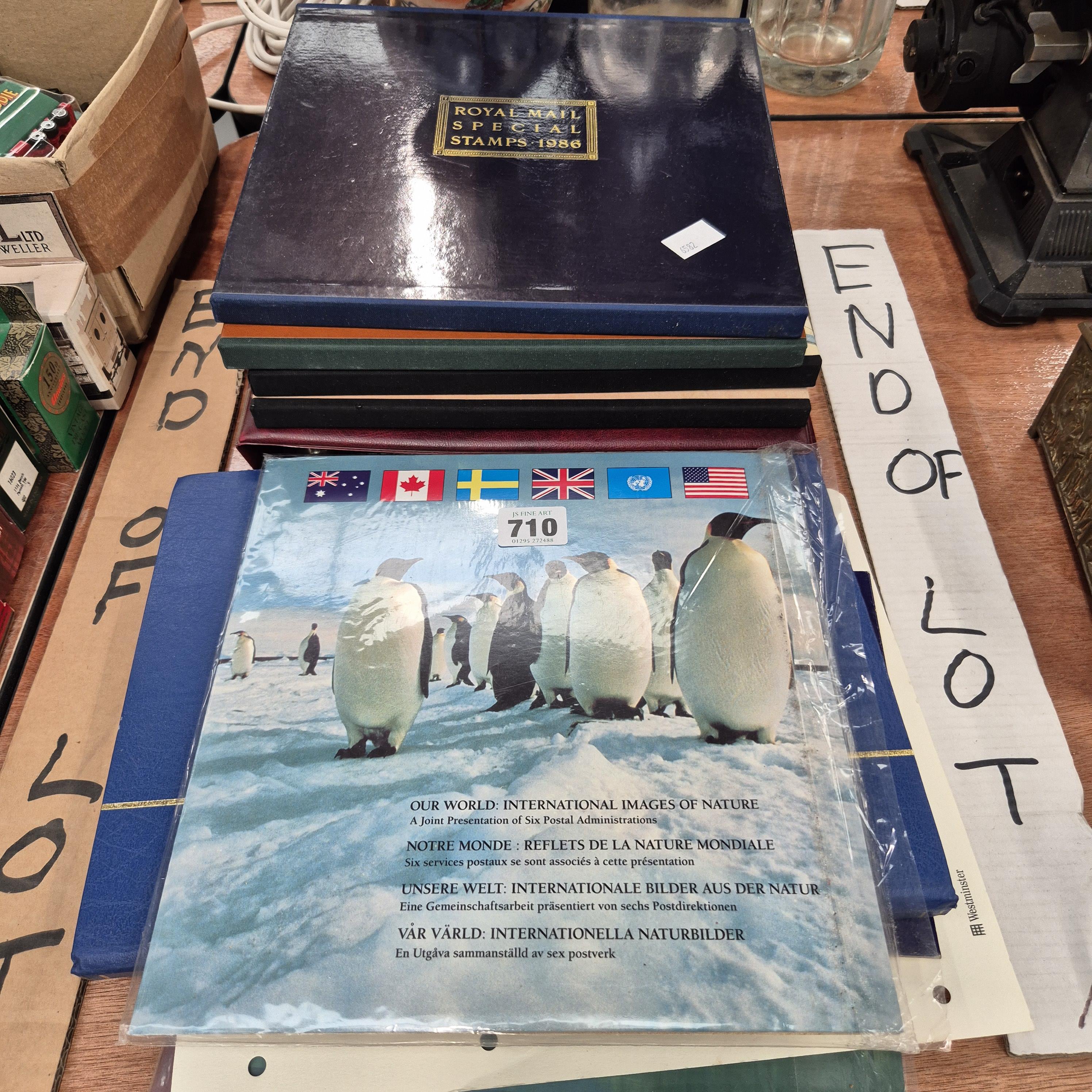 Stamp albums together with souvenir coins and medallions