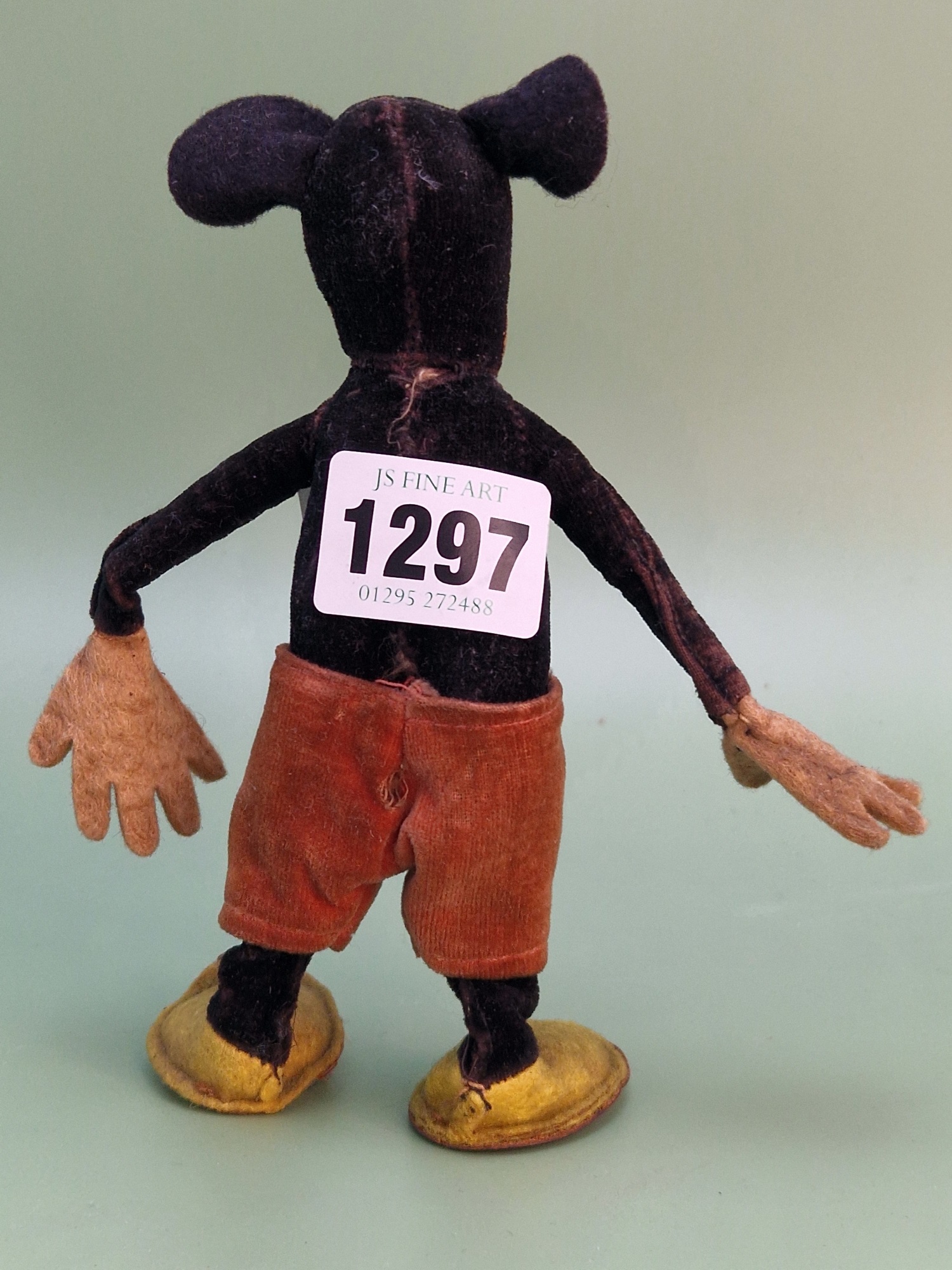 An early poseable toy figure of Mickey Mouse