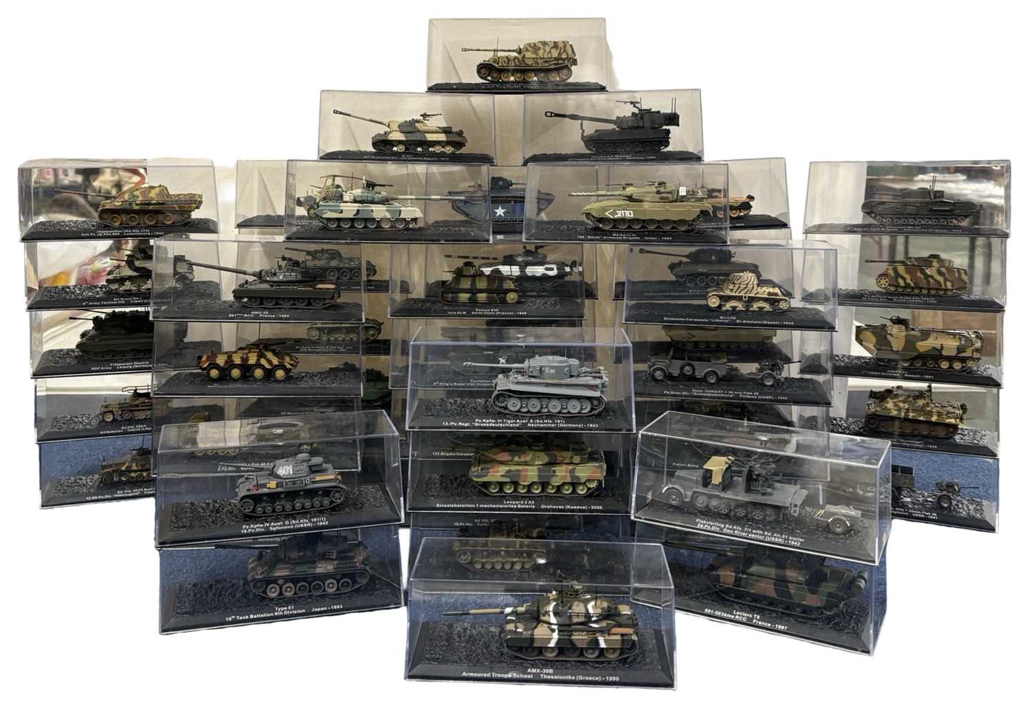 An extensive collection of (mostly cased) military vehicles from The ...