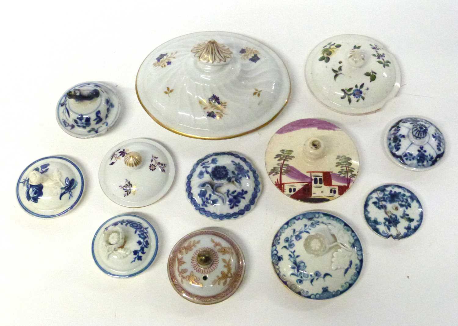 A collection of 18th Century porcelain lids including Lowestoft example ...