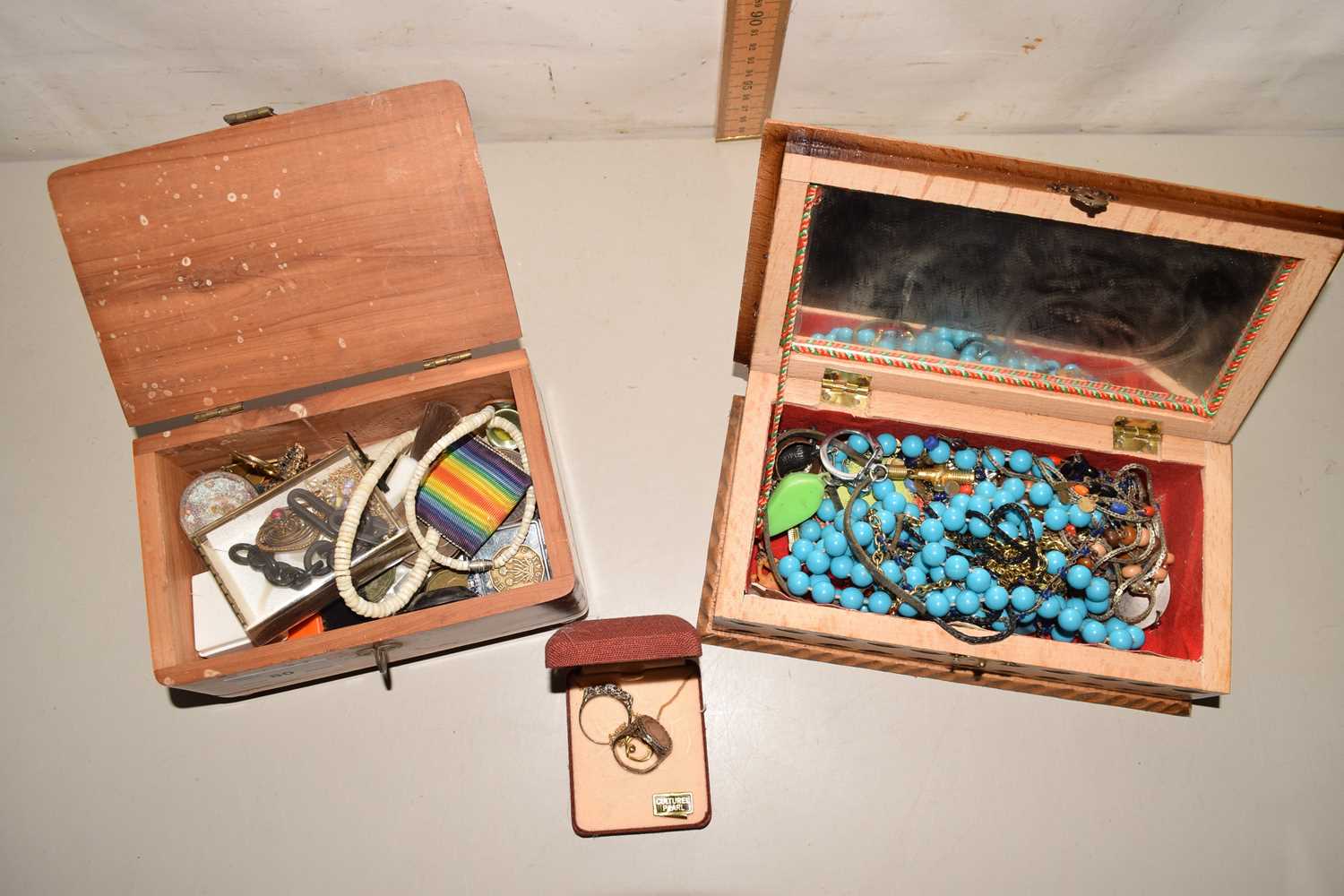 Two boxes of assorted costume jewellery, coinage etc