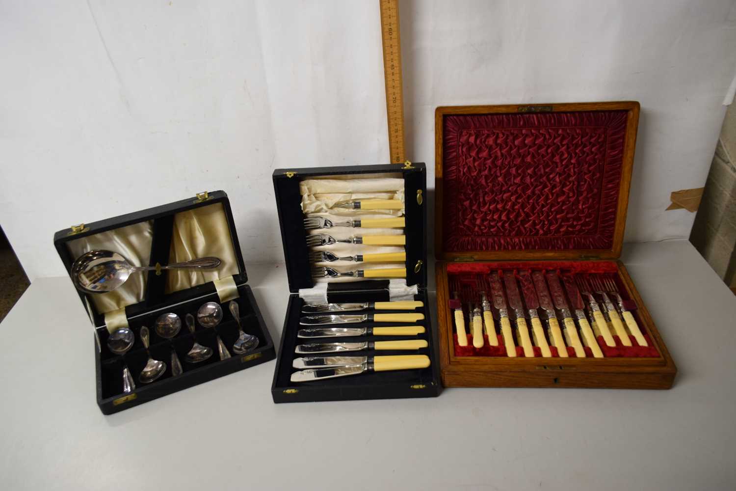 Three cases of cutlery to include simulated ivory handled examples