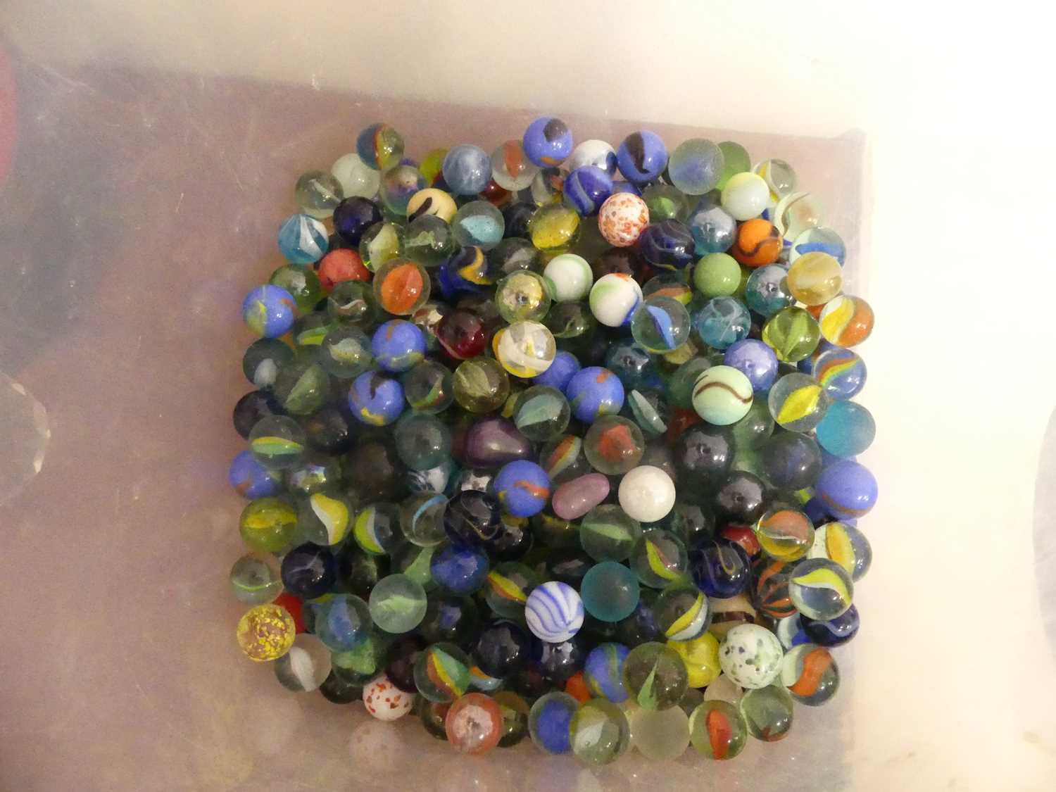 A collection of glass marbles, various designs and colours